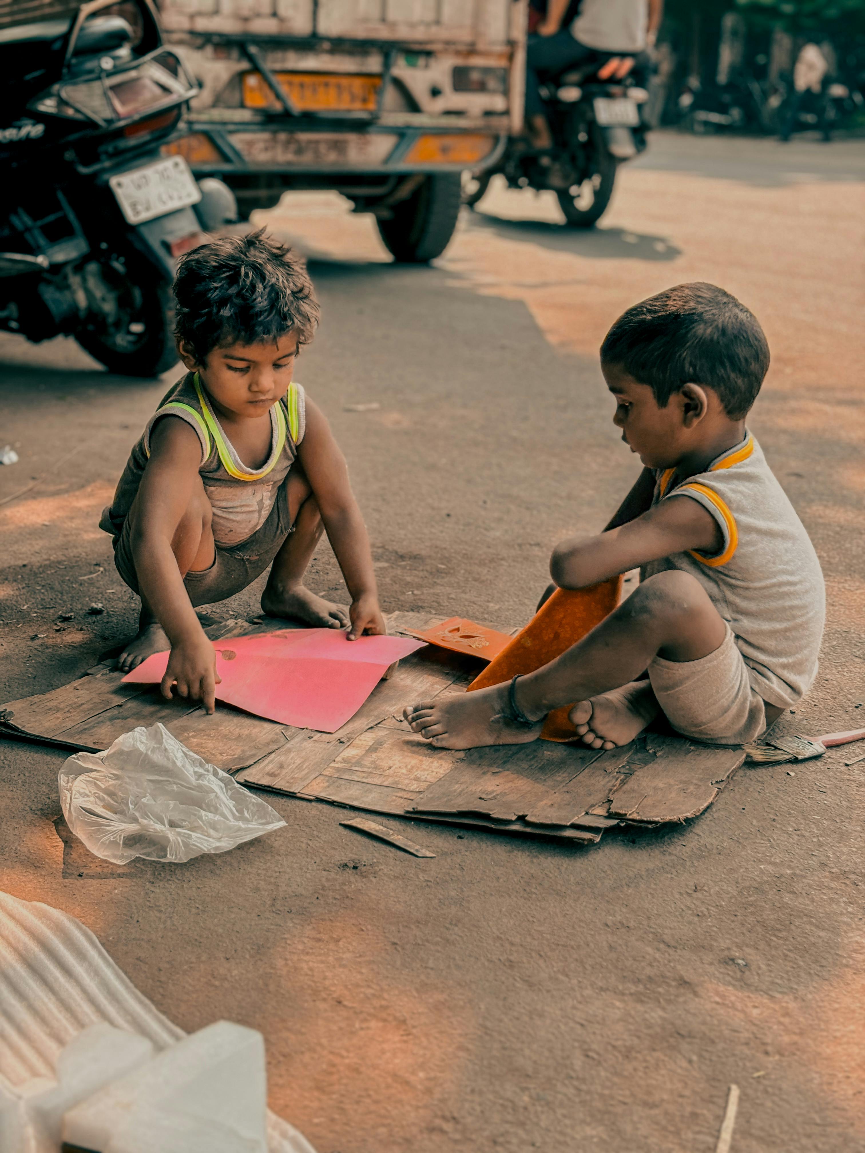 Street Children Engaging in Creative Play in India · Free Stock Photo