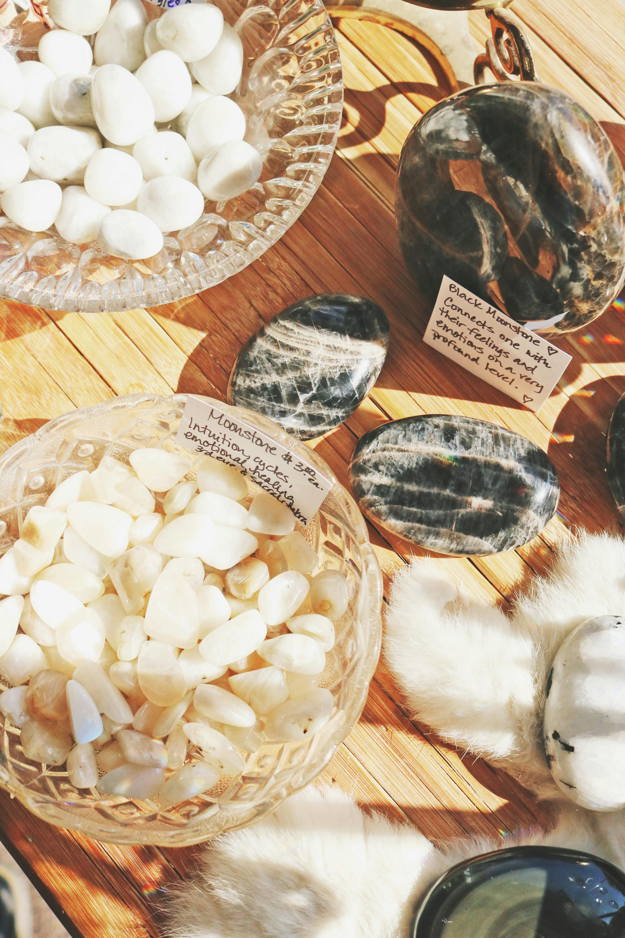 Close-Up Shot of Assorted Crystals on Clear Glass Bowls · Free Stock Photo
