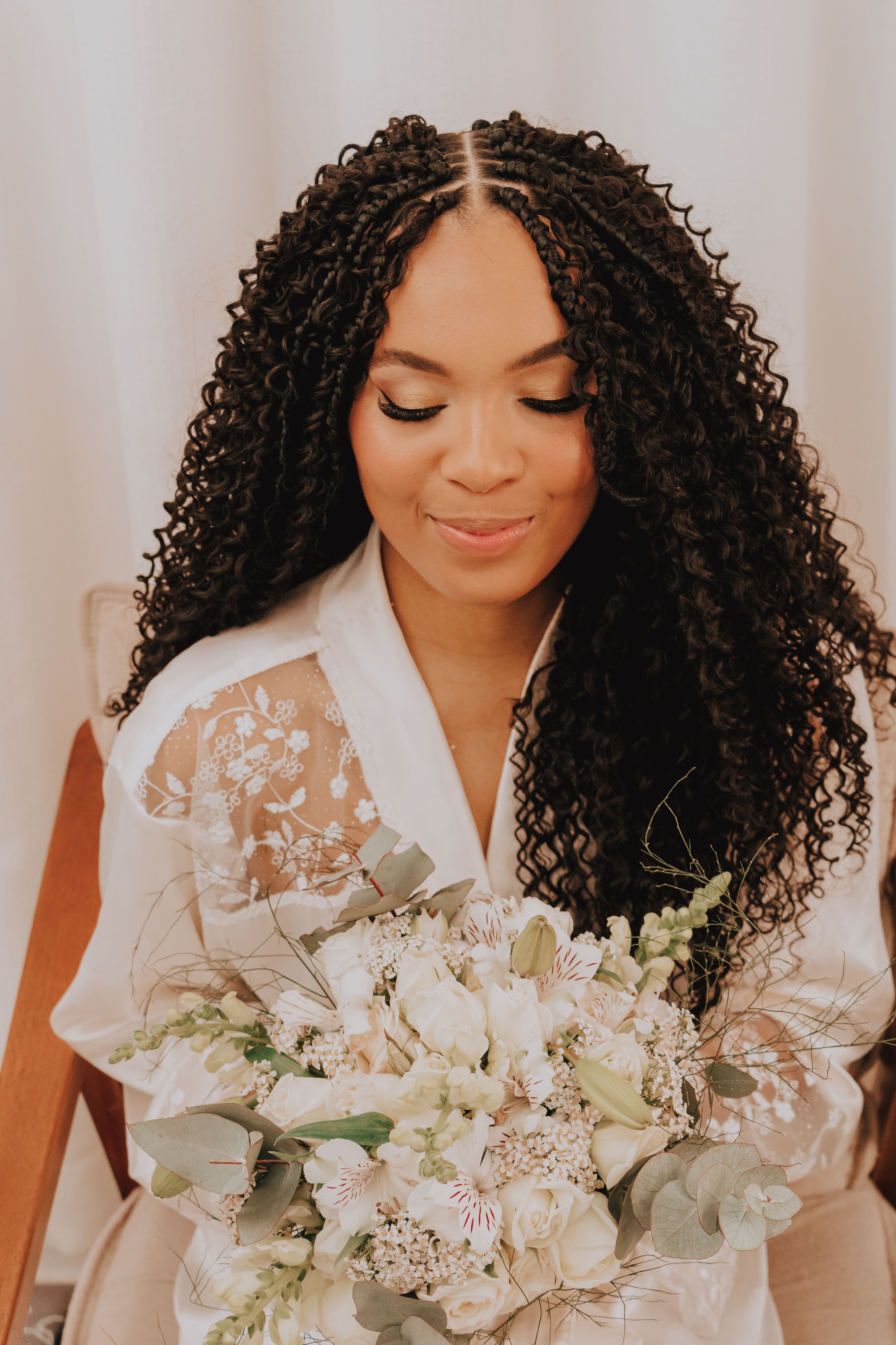 Elegant Bride with Curly Hair Holding Bouquet · Free Stock Photo