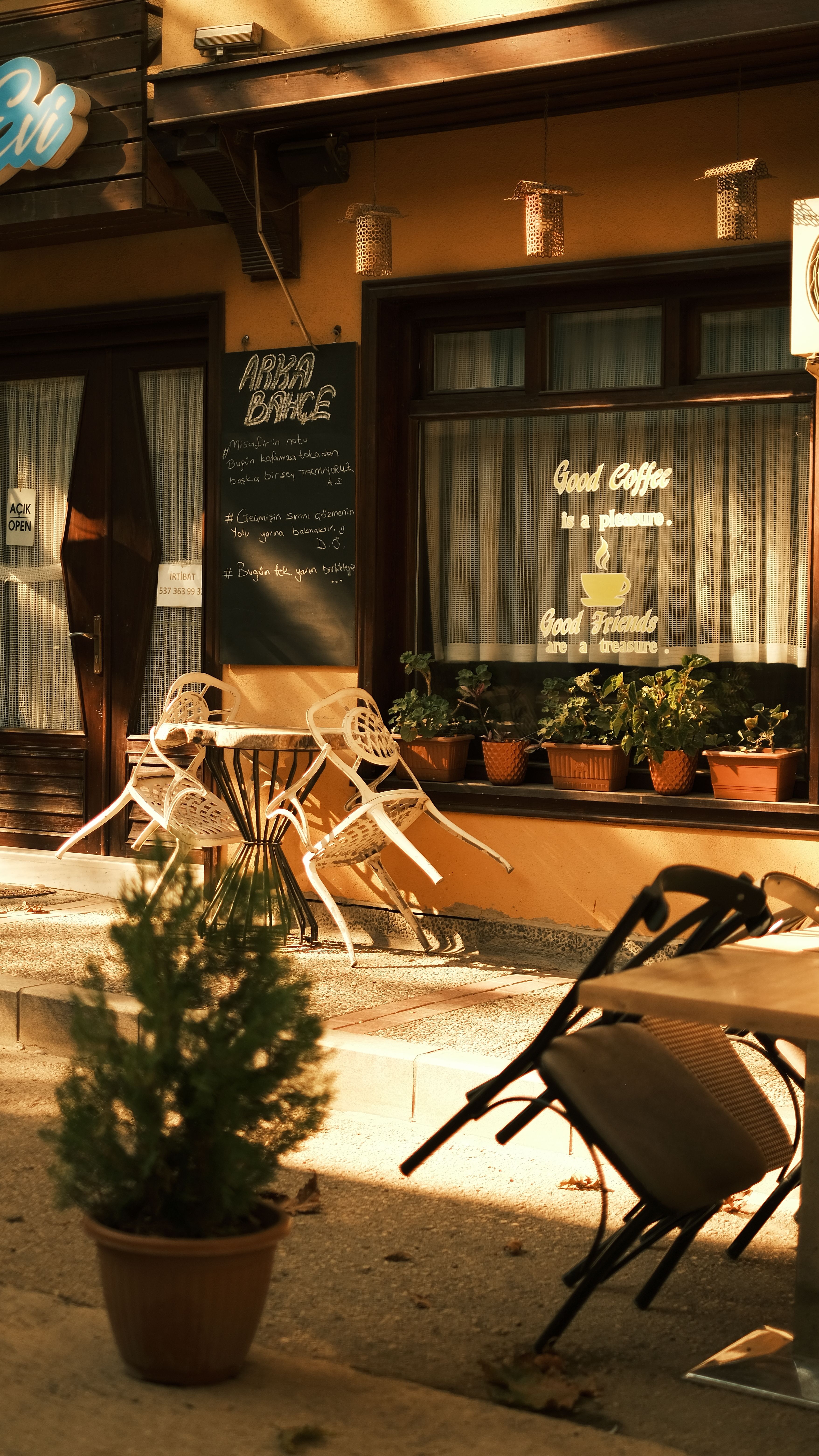 Cozy Outdoor Cafe with Ambient Lighting · Free Stock Photo