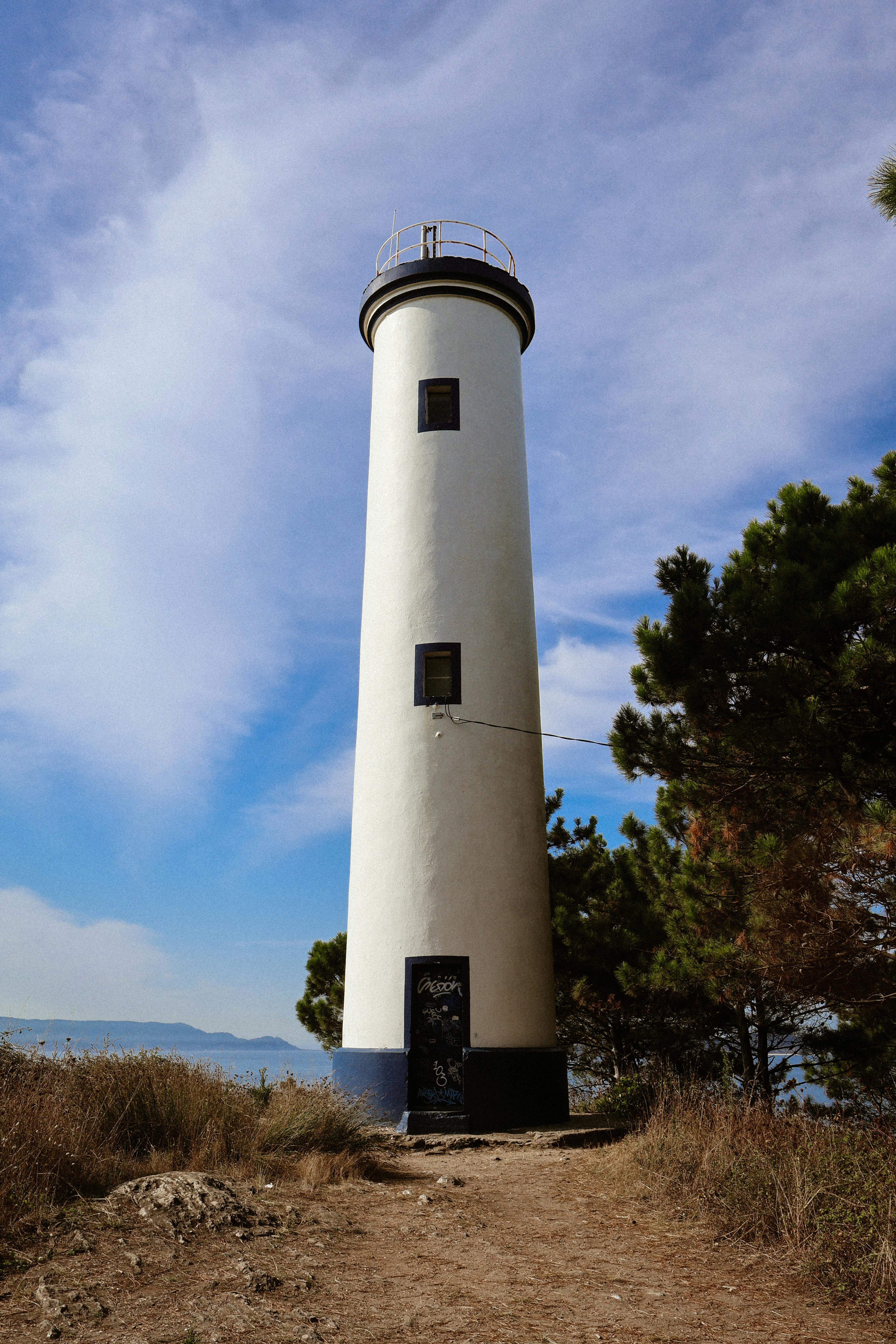 Gray Scale Photography of Lighthouse · Free Stock Photo