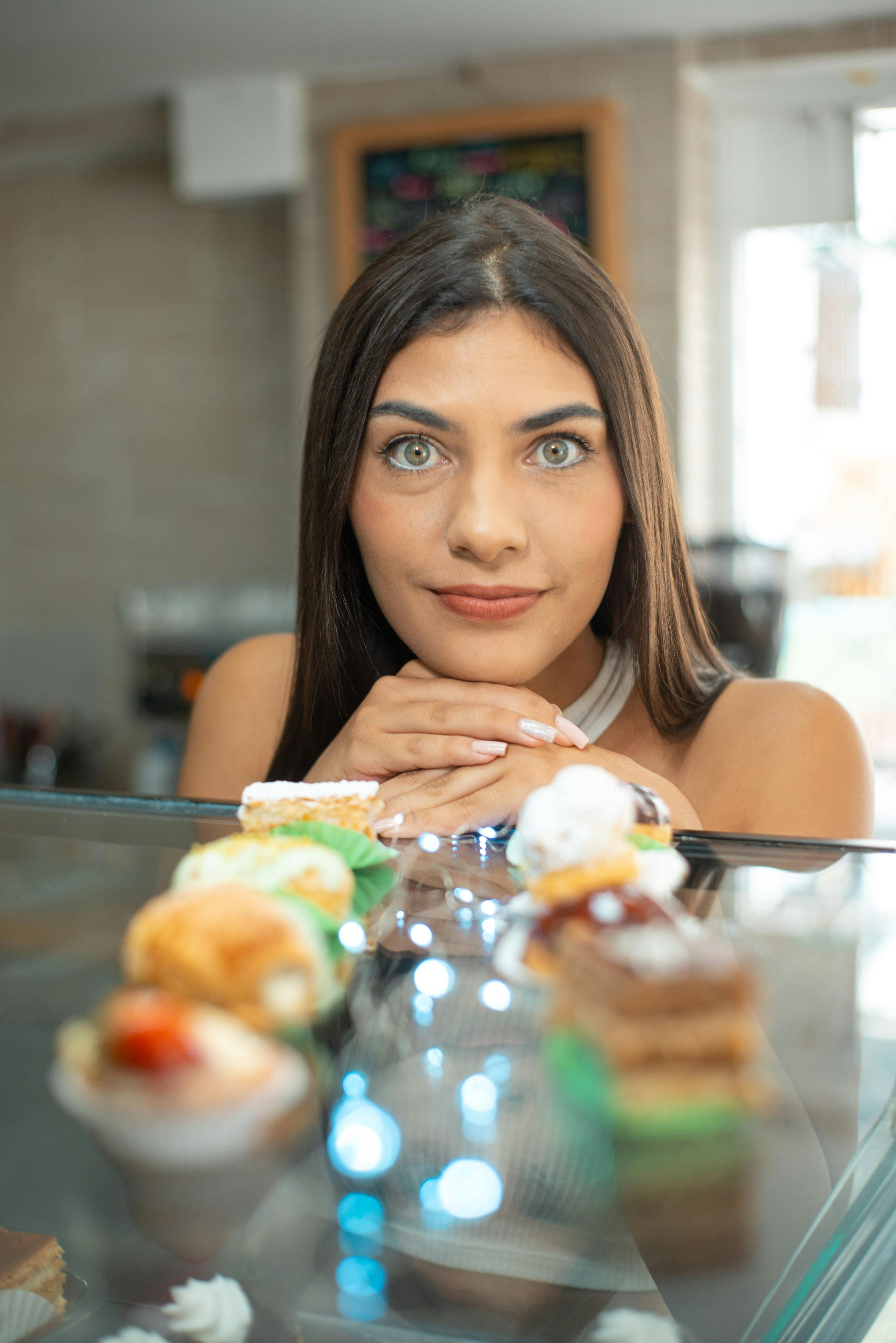 Portrait of Woman with Pastries in Bakery · Free Stock Photo