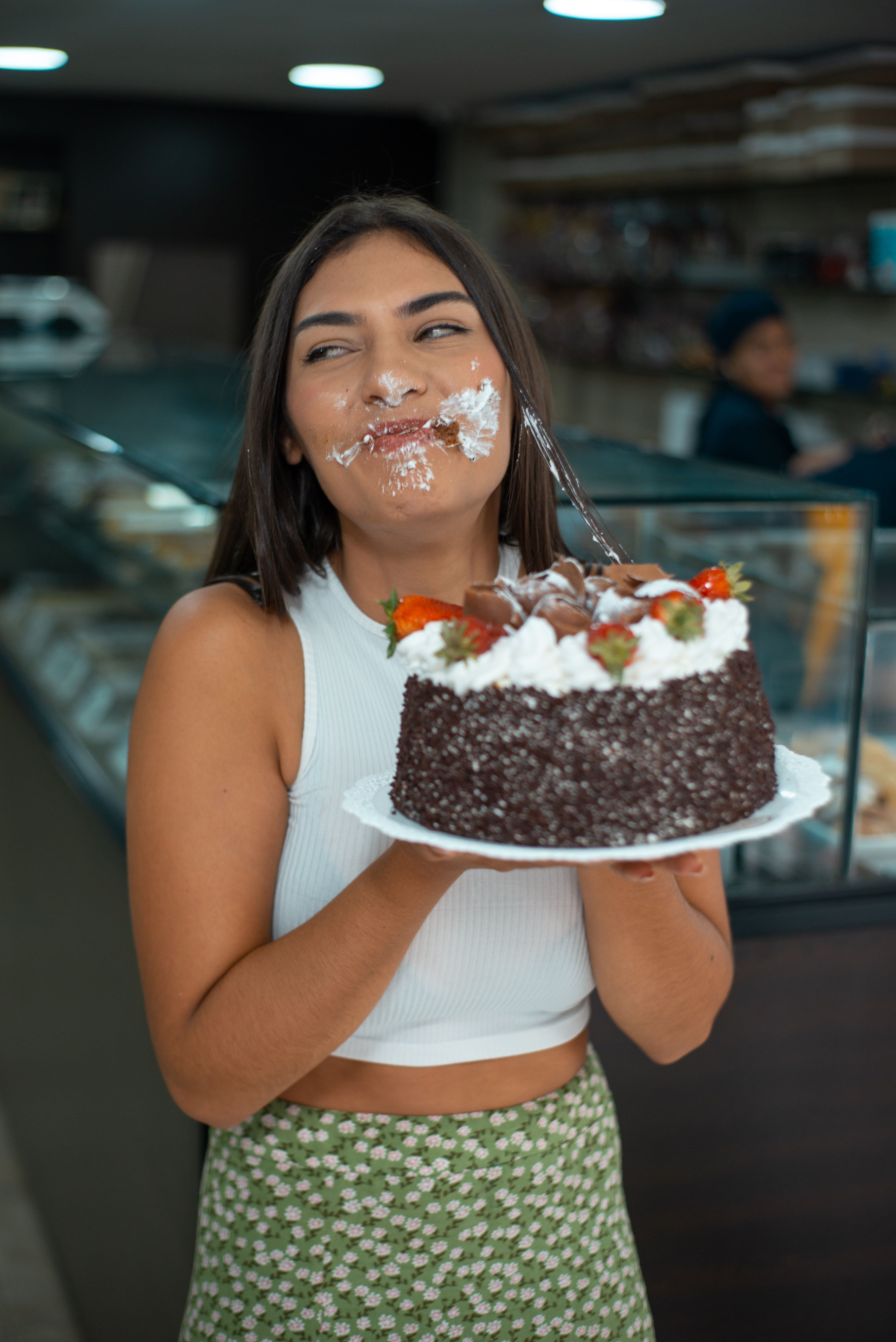 Woman Enjoying Chocolate Cake in Venezuelan Bakery · Free Stock Photo