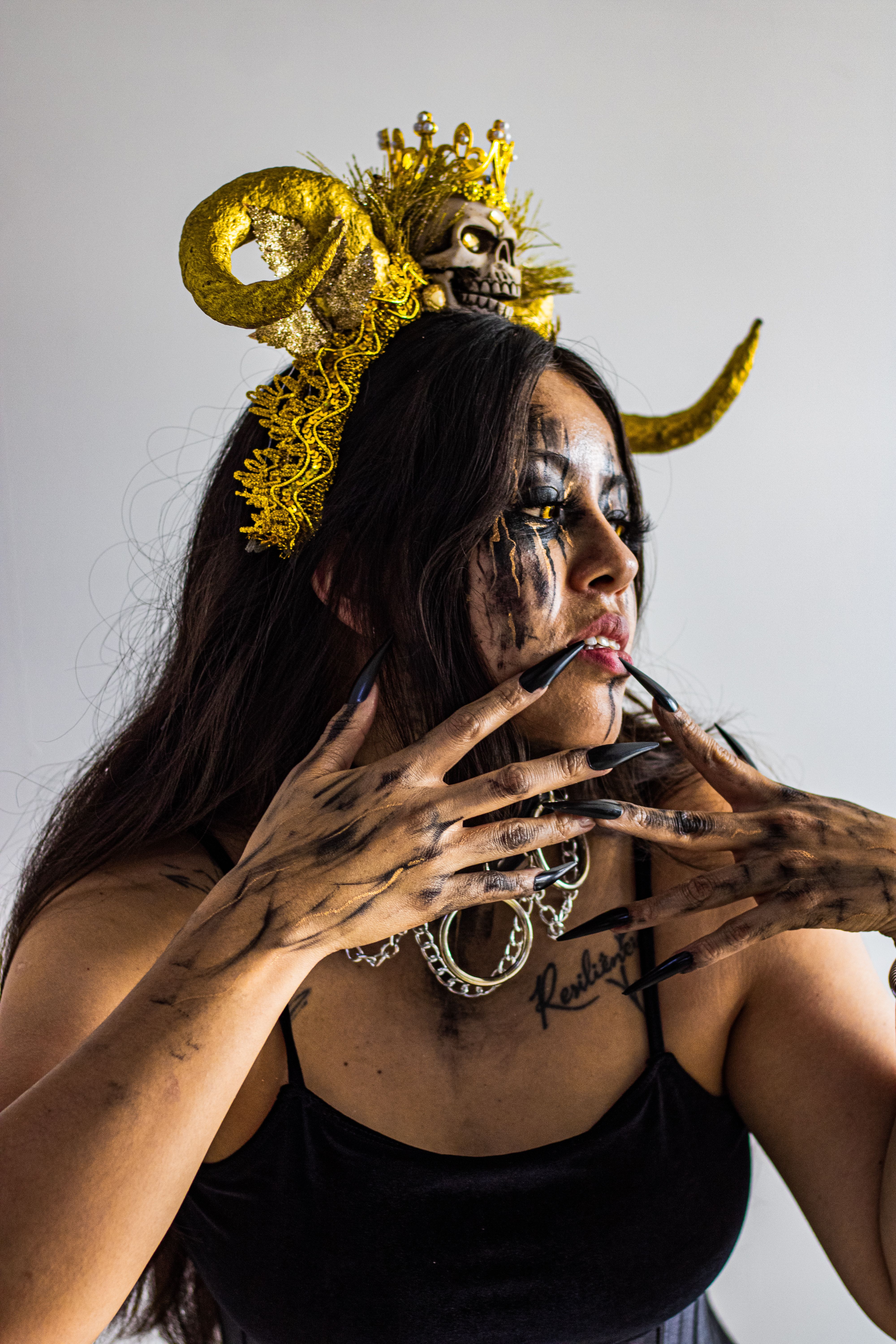Dramatic Artistic Makeup with Golden Horns · Free Stock Photo