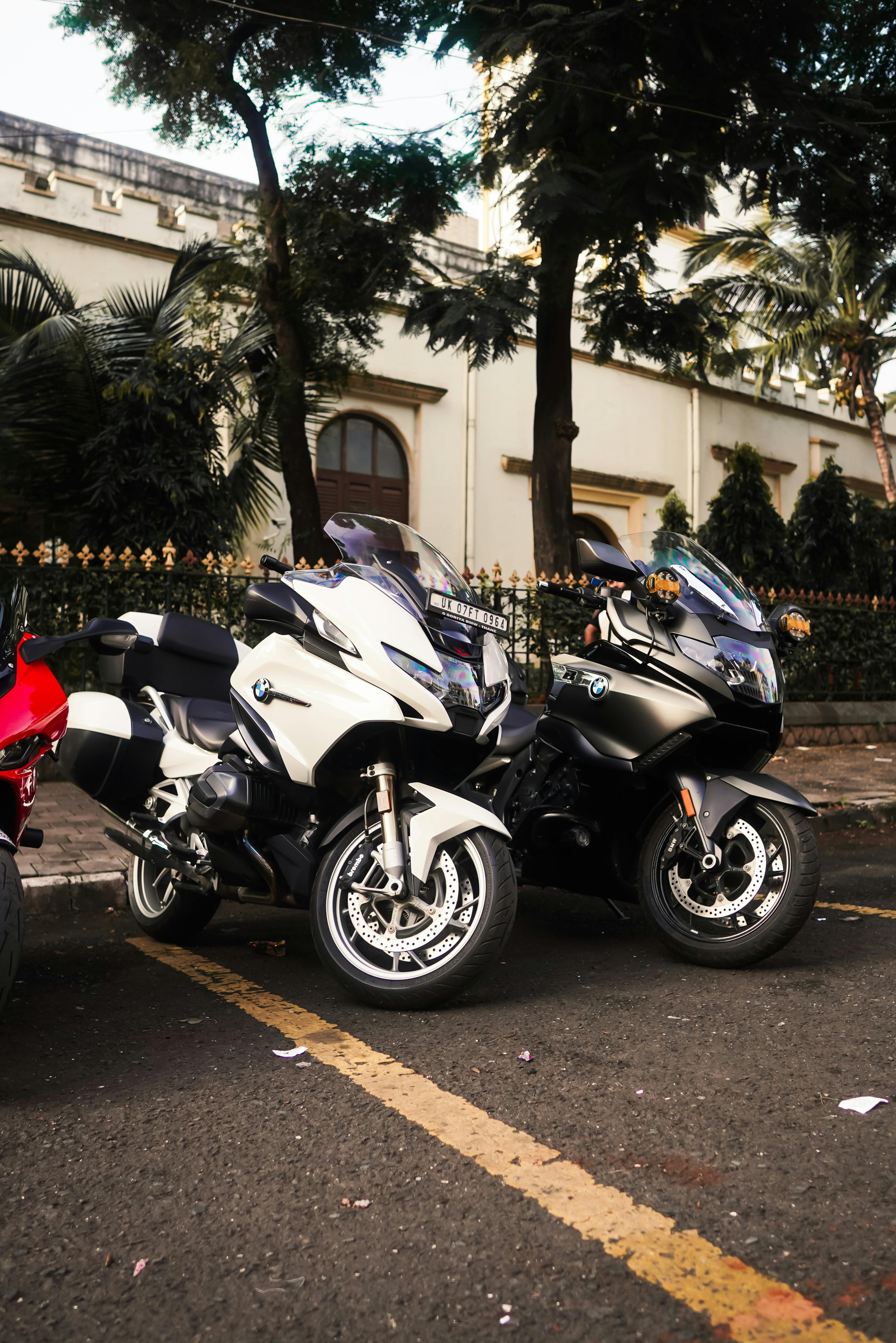 Luxury Motorcycles Parked on Urban Street · Free Stock Photo