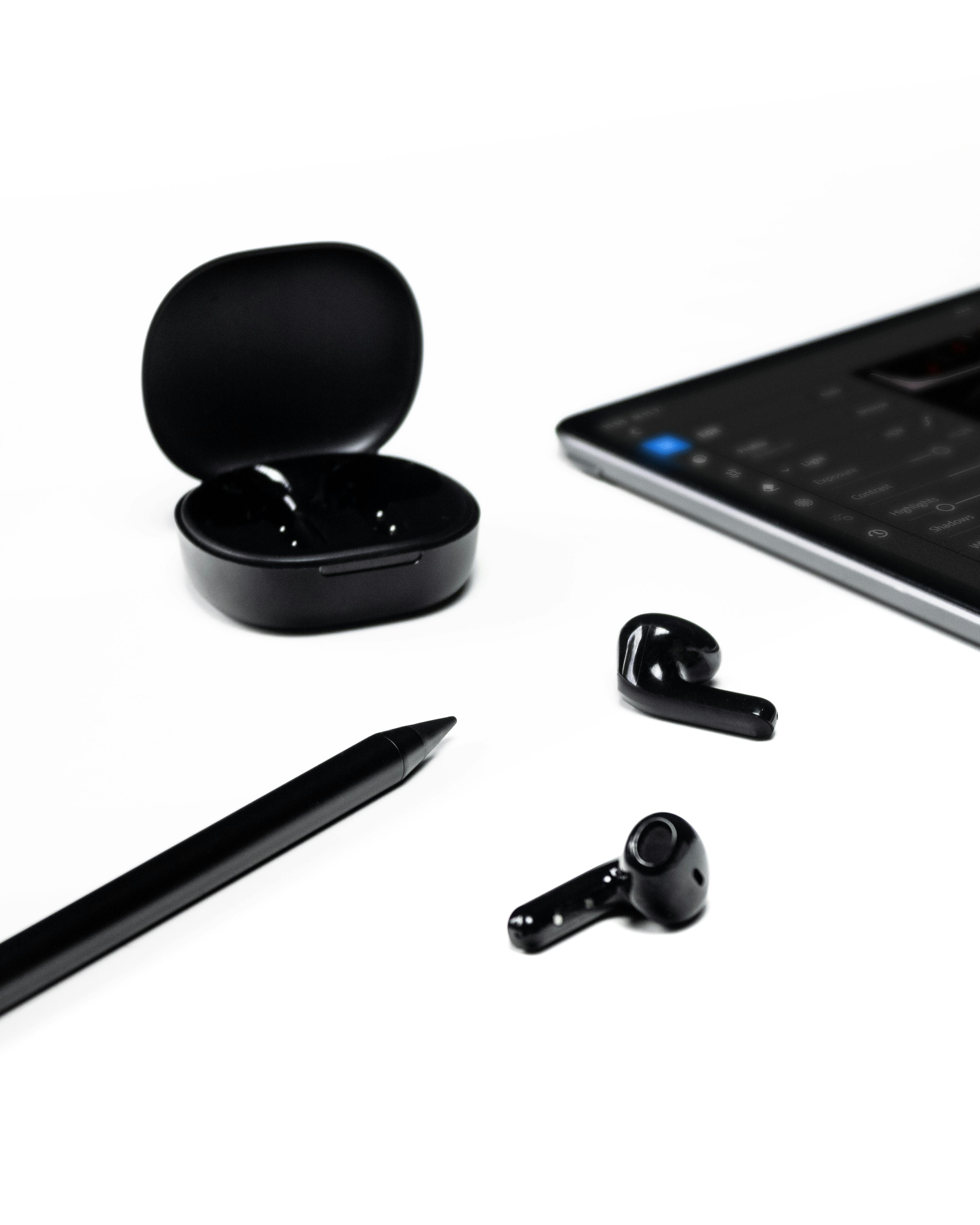 Minimalist Black Gadgets on White Background · Free Stock Photo