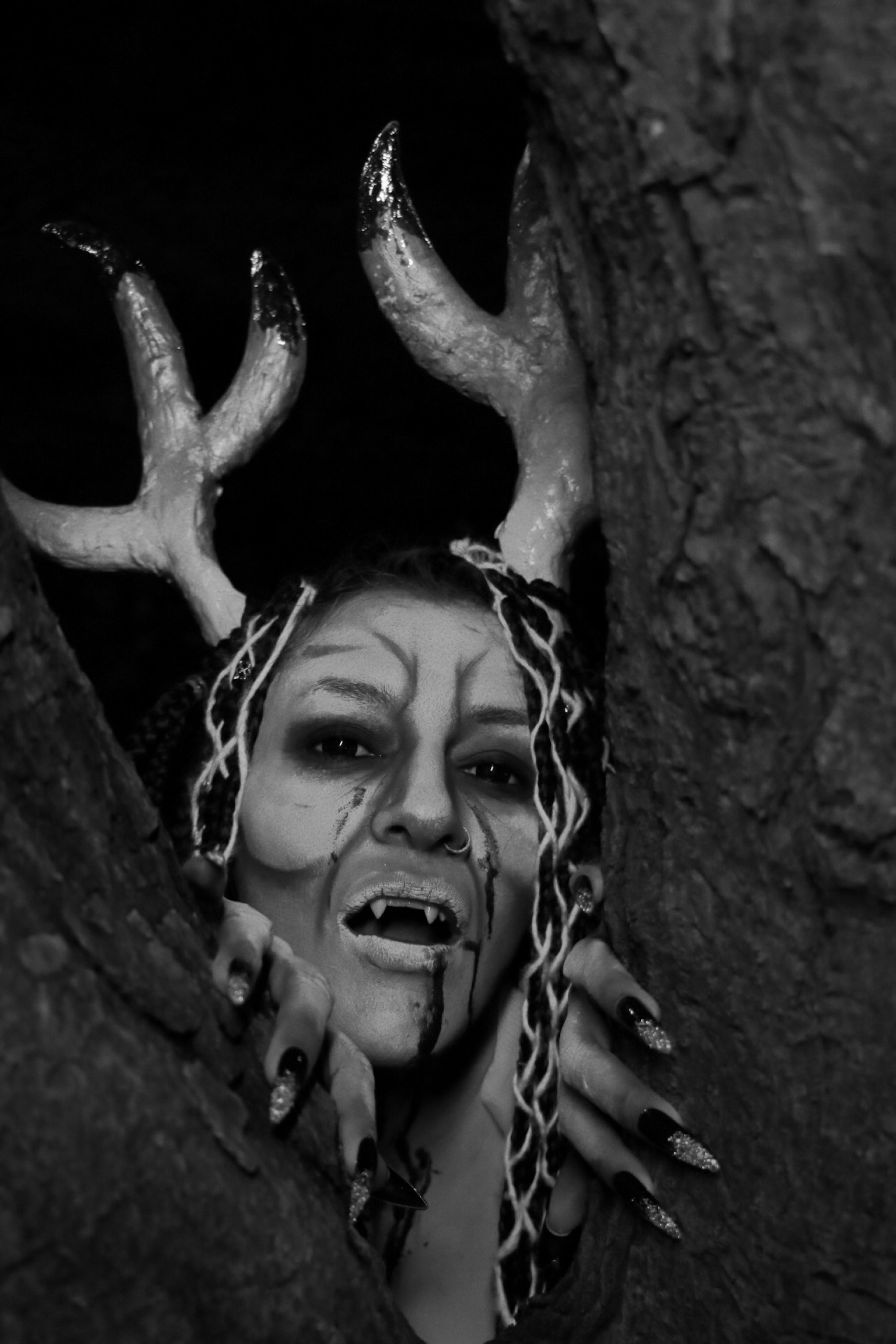 Eerie Gothic Figure with Antlers in Forest Setting · Free Stock Photo