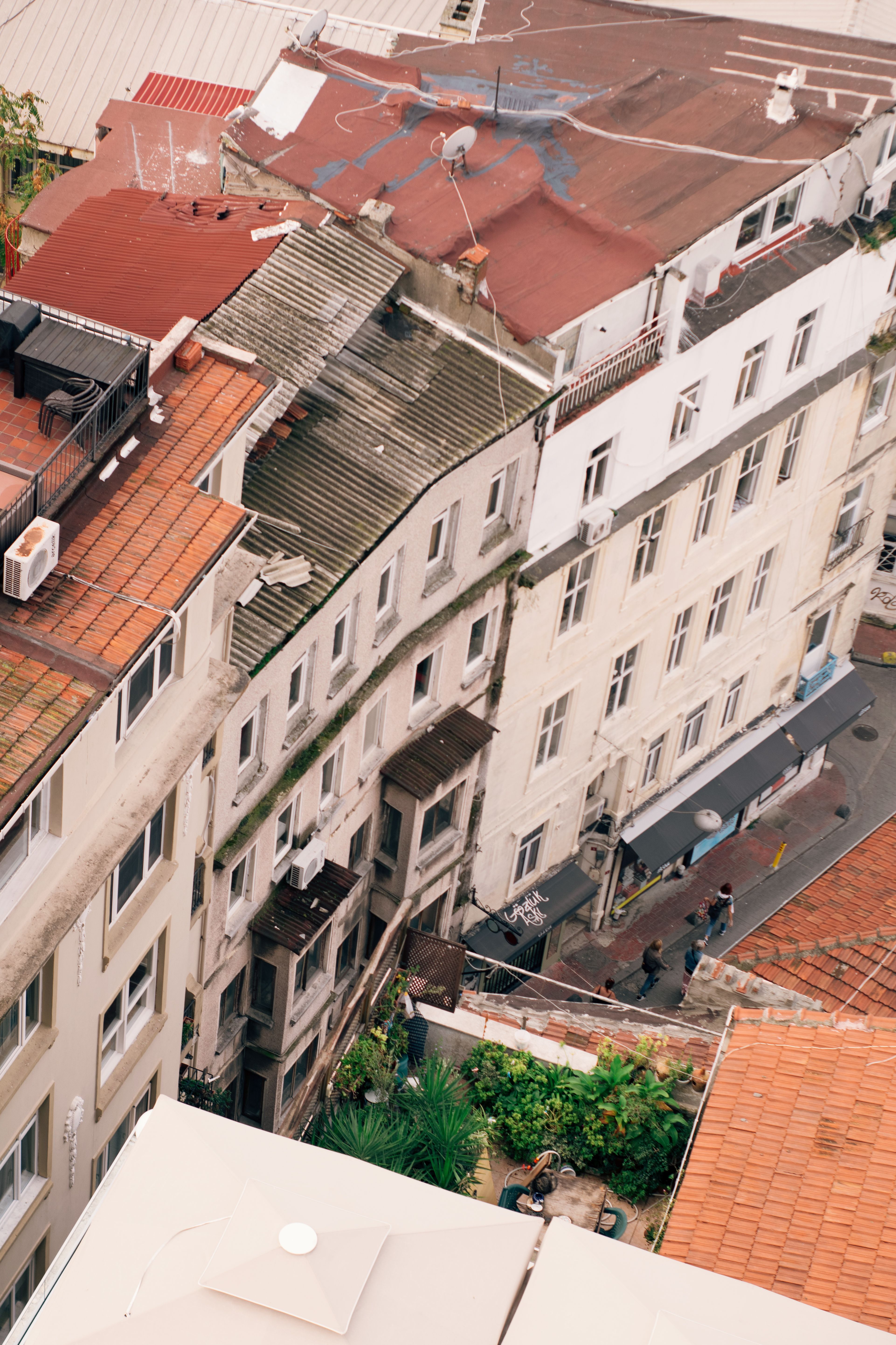 Aerial View of Urban Rooftops and Narrow Street · Free Stock Photo