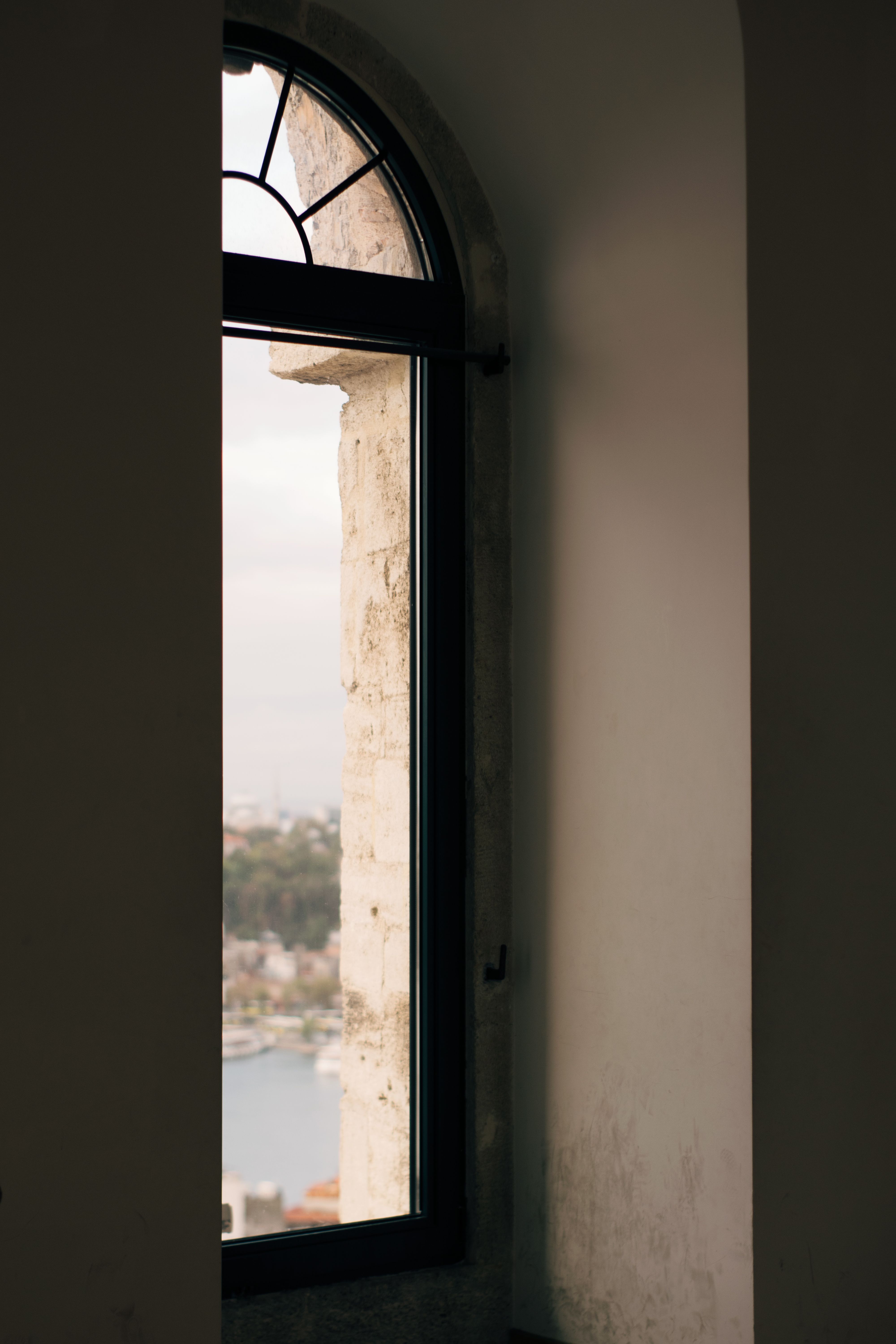Scenic View Through Vintage Arched Window · Free Stock Photo