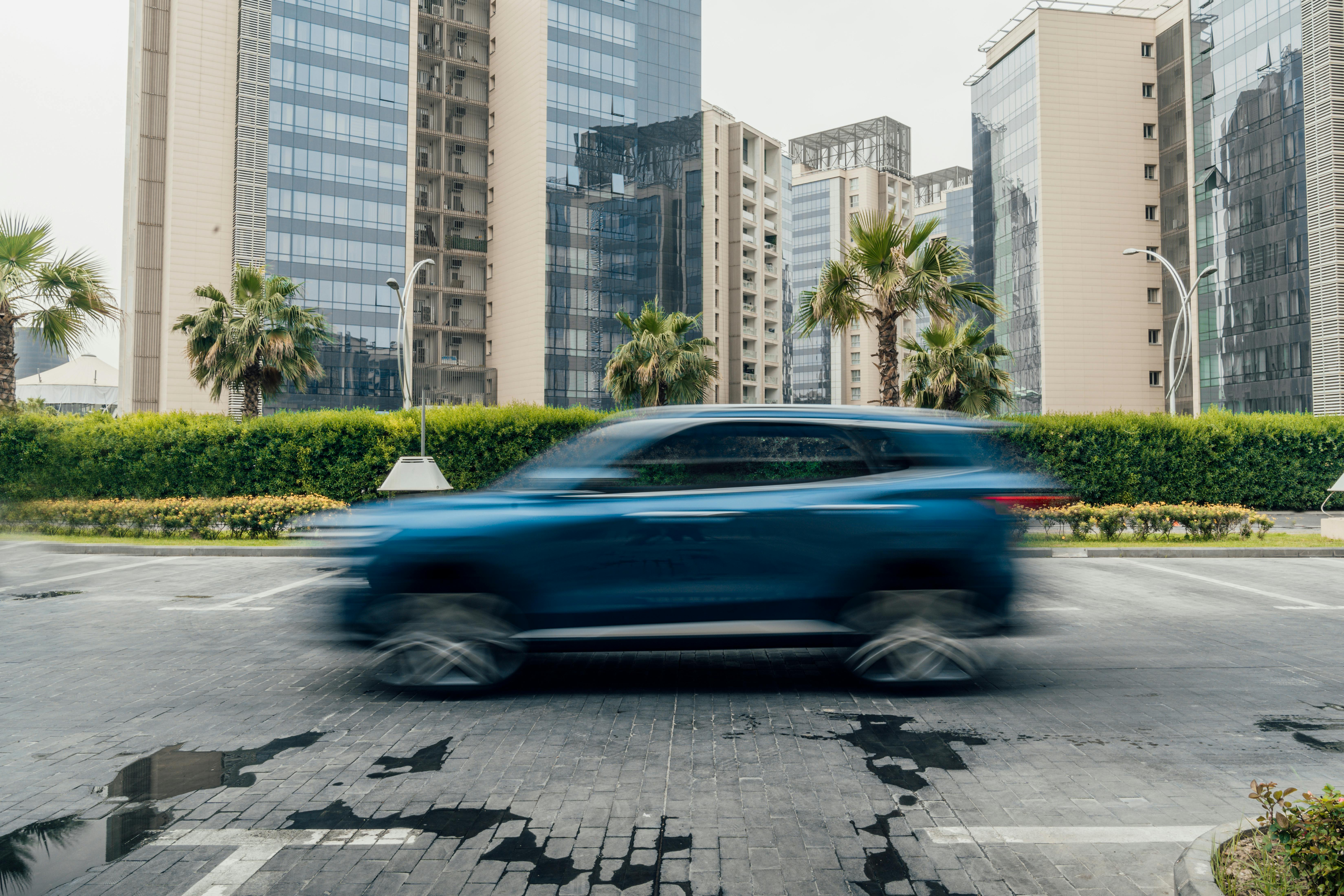 Speeding Car in Erbil Urban Landscape · Free Stock Photo