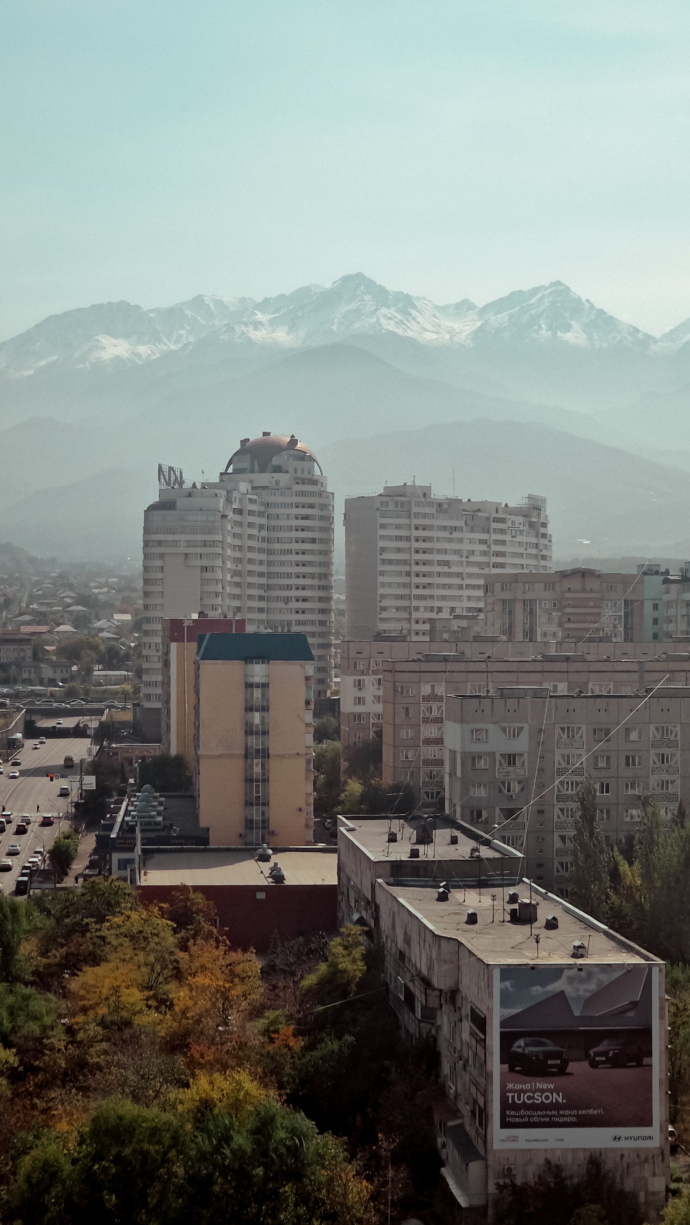 Scenic Urban View of Almaty with Mountain Backdrop · Free Stock Photo