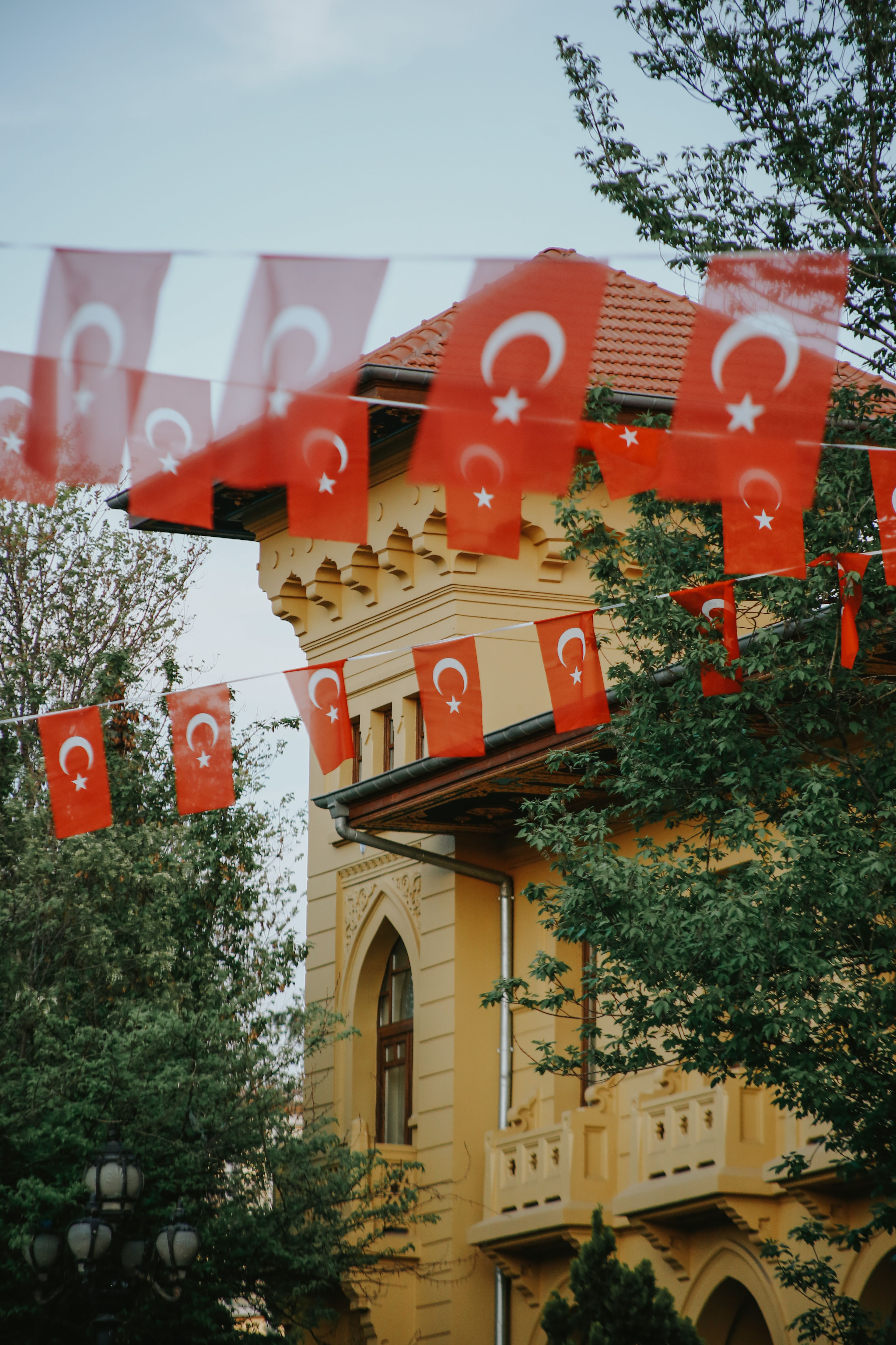 Turkish Flags Adorning Vintage Building · Free Stock Photo