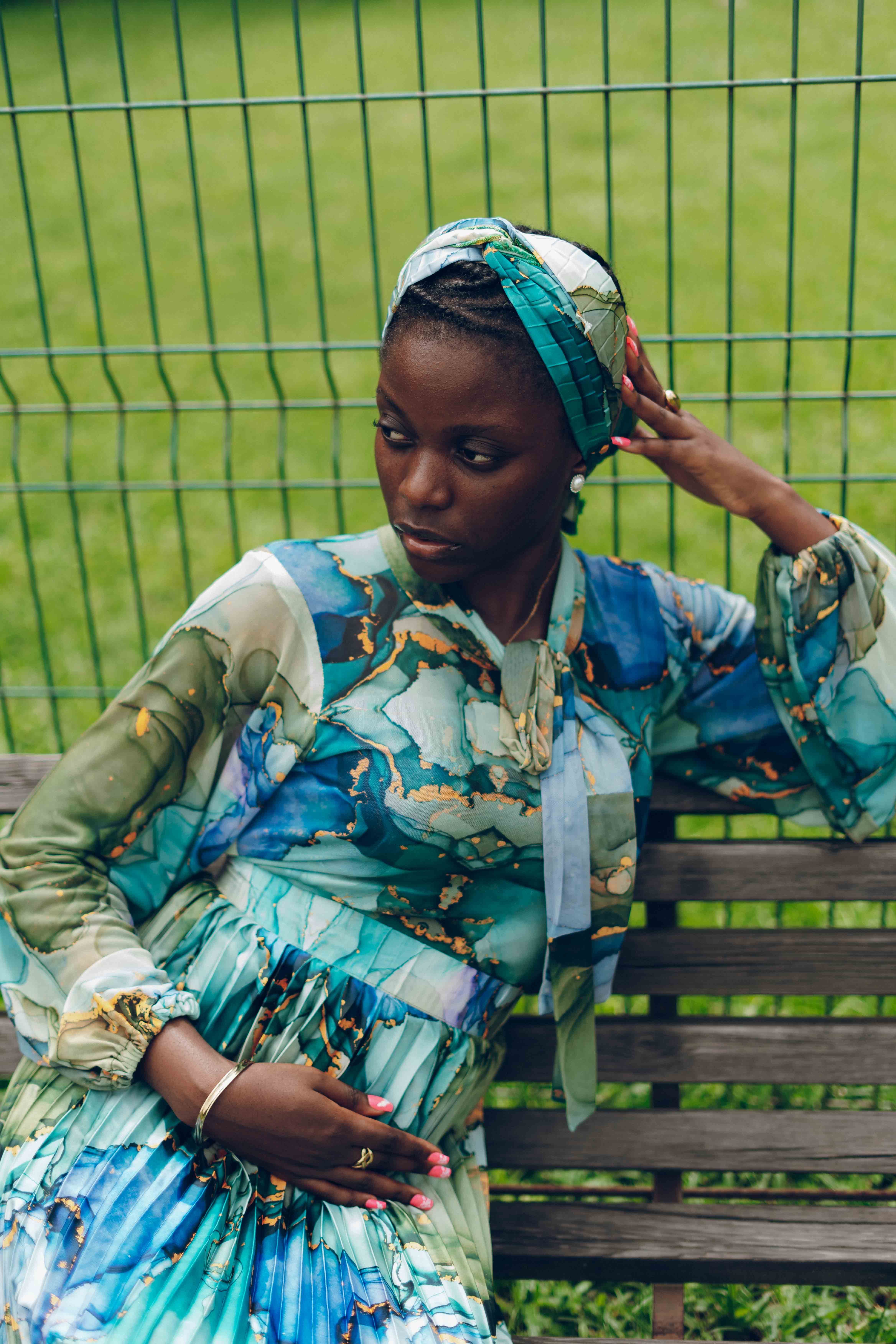 Elegant African Fashion in Vibrant Outdoor Setting · Free Stock Photo