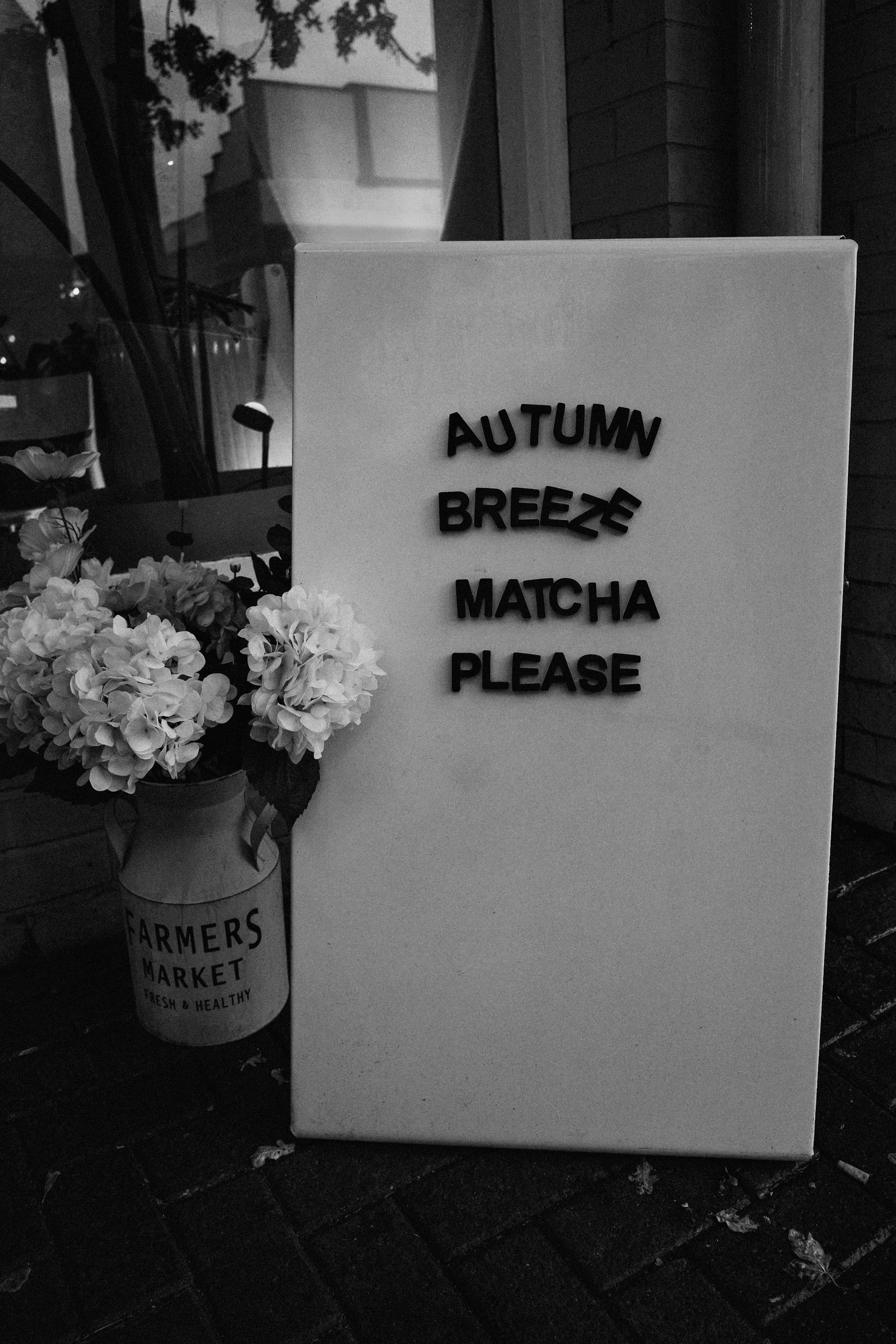 Black and White Autumn Cafe Sign with Flowers · Free Stock Photo