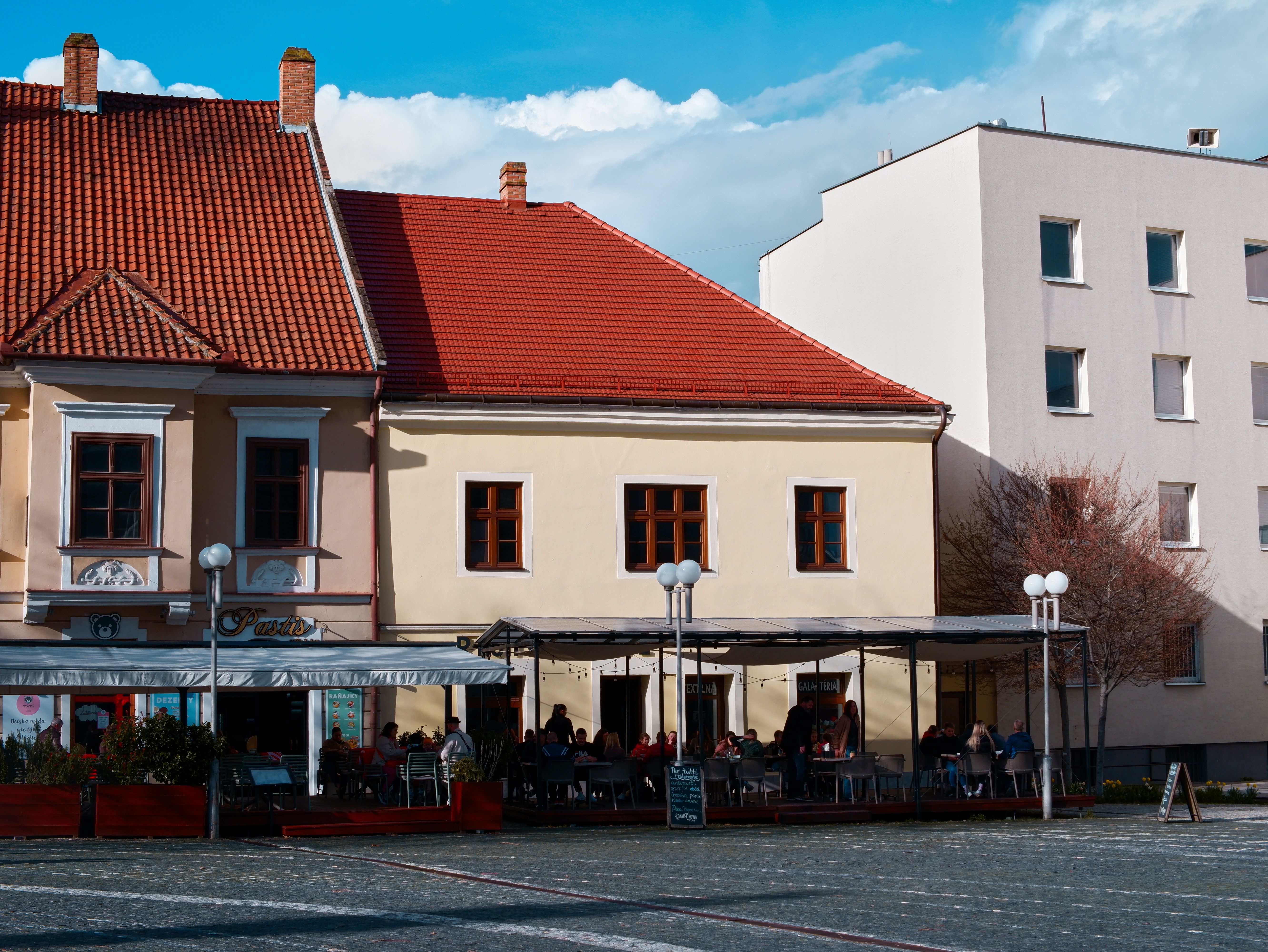 Charming European Street View with Café Scene · Free Stock Photo