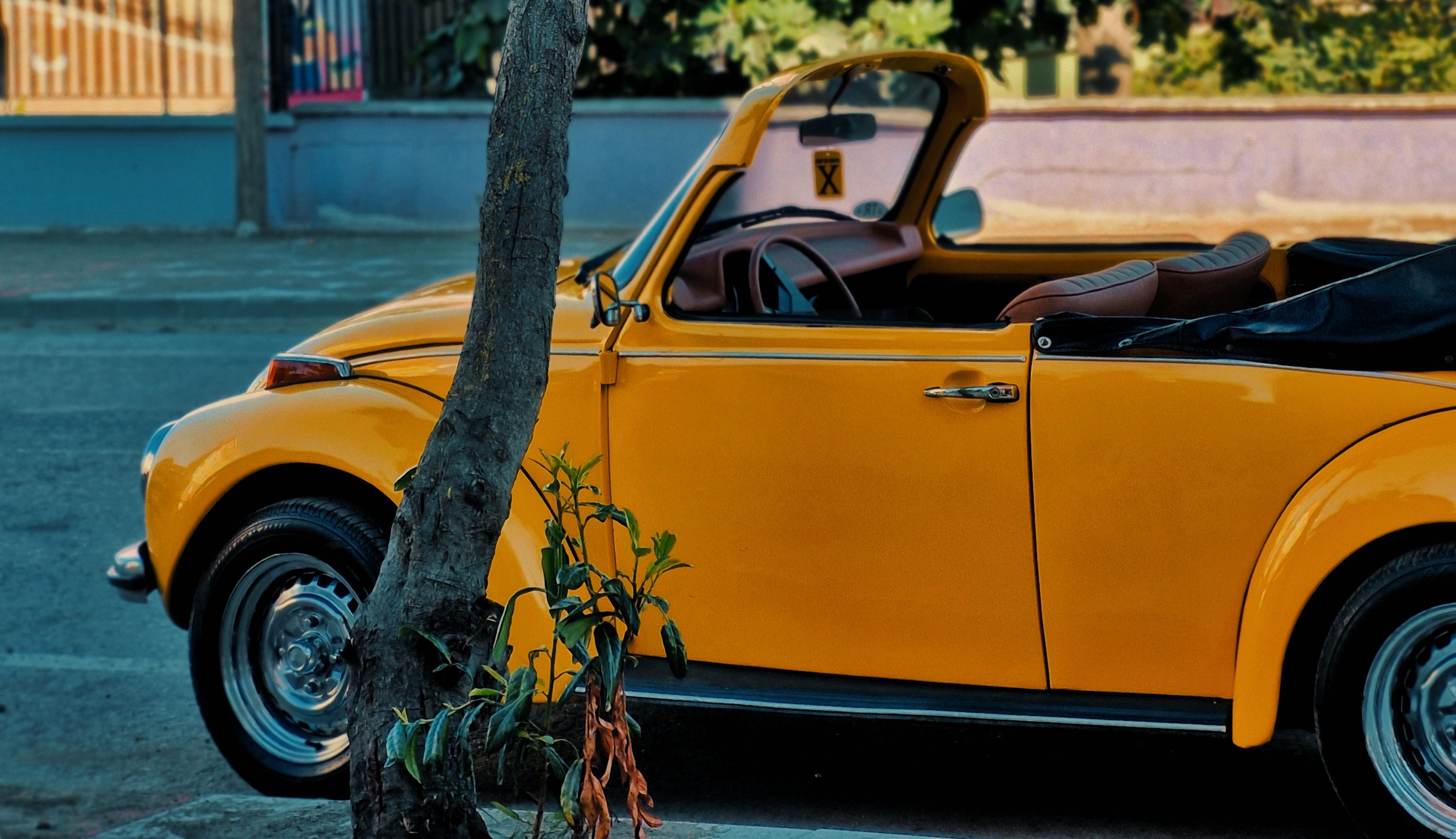 Vintage Yellow Convertible Parked on Street · Free Stock Photo