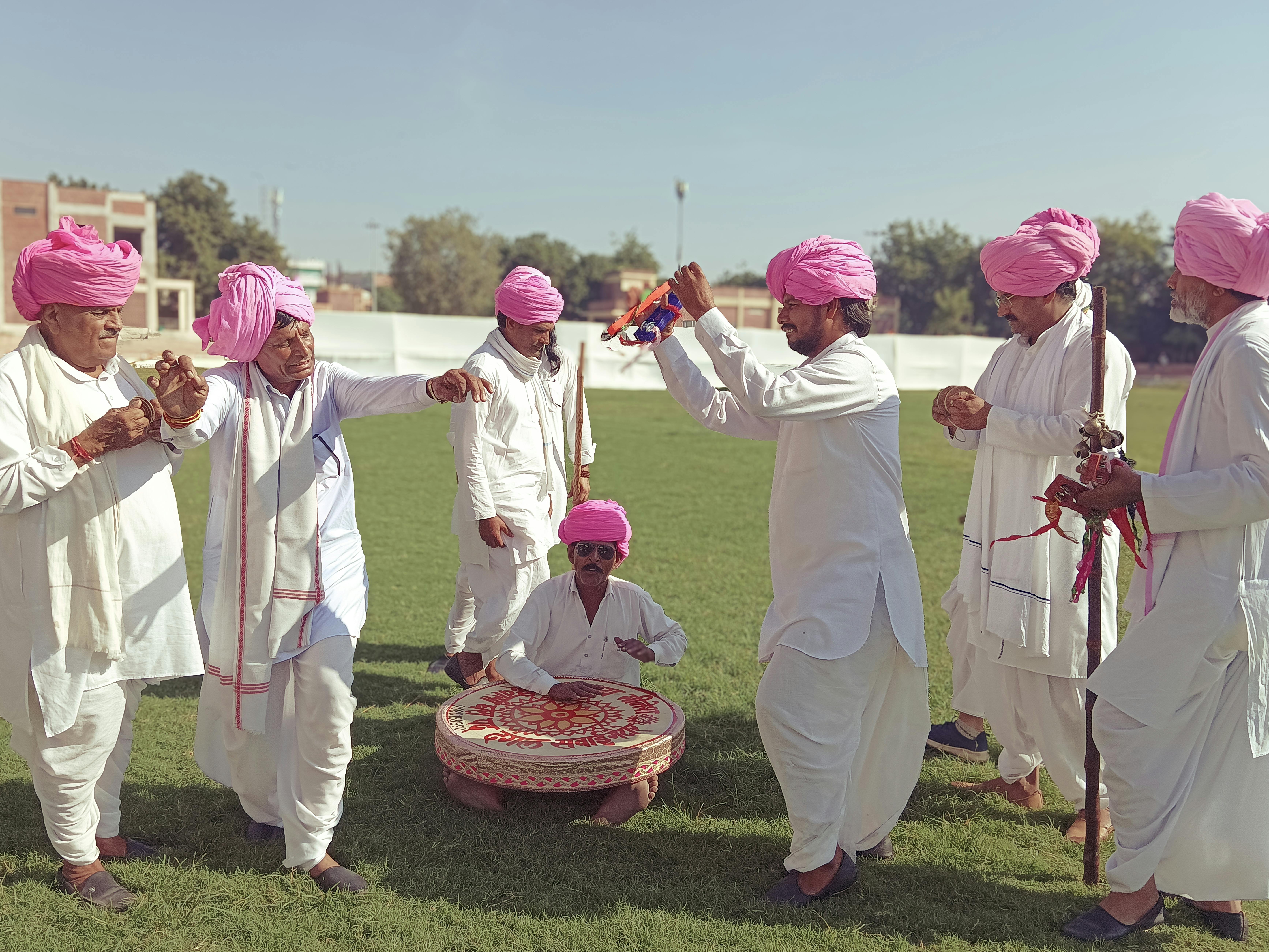 Traditional Rajasthani Men Performing Folk Dance Outdoors · Free Stock ...
