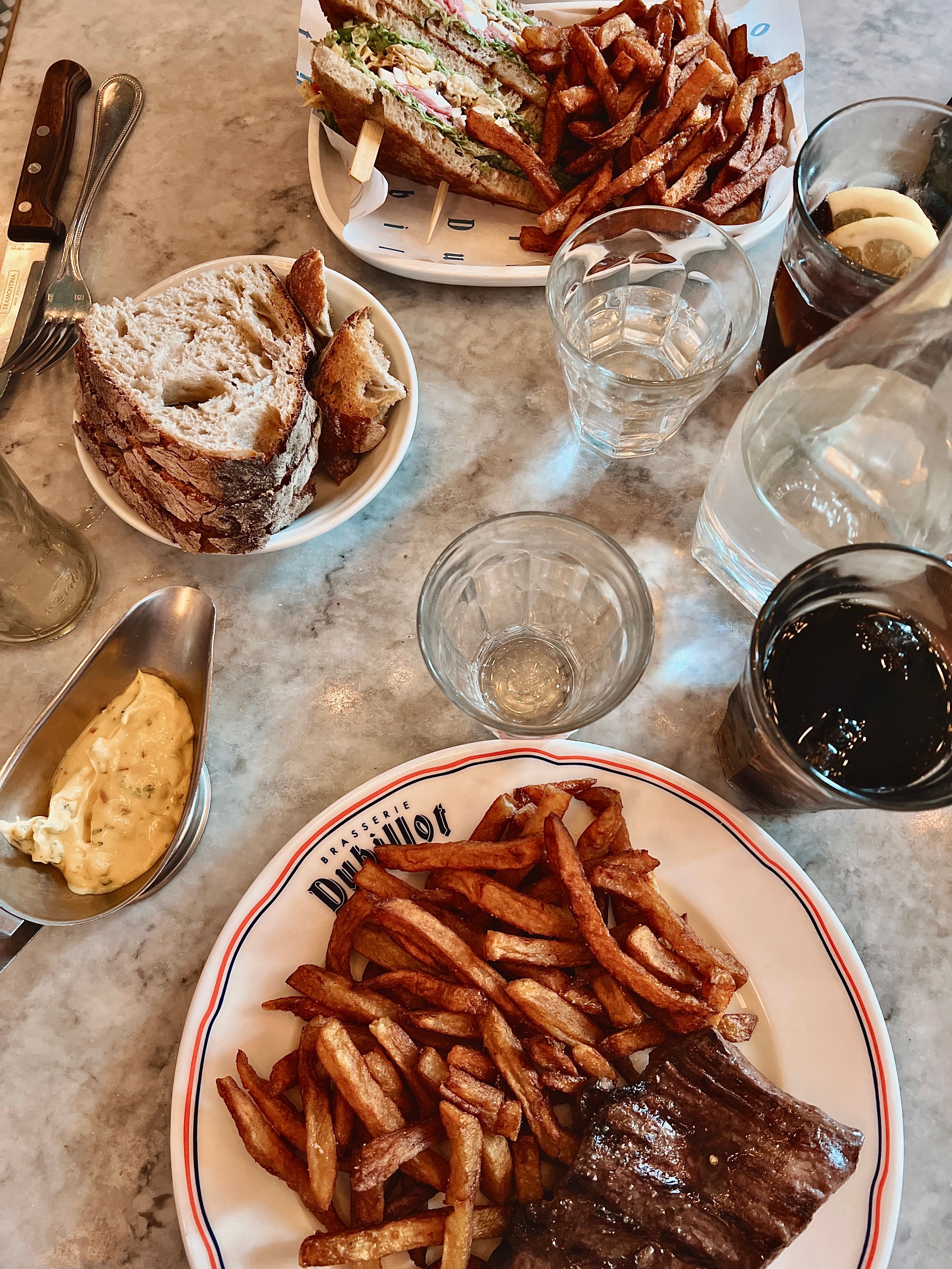 Gourmet Meal with Sandwich and Fries on Marble Table · Free Stock Photo