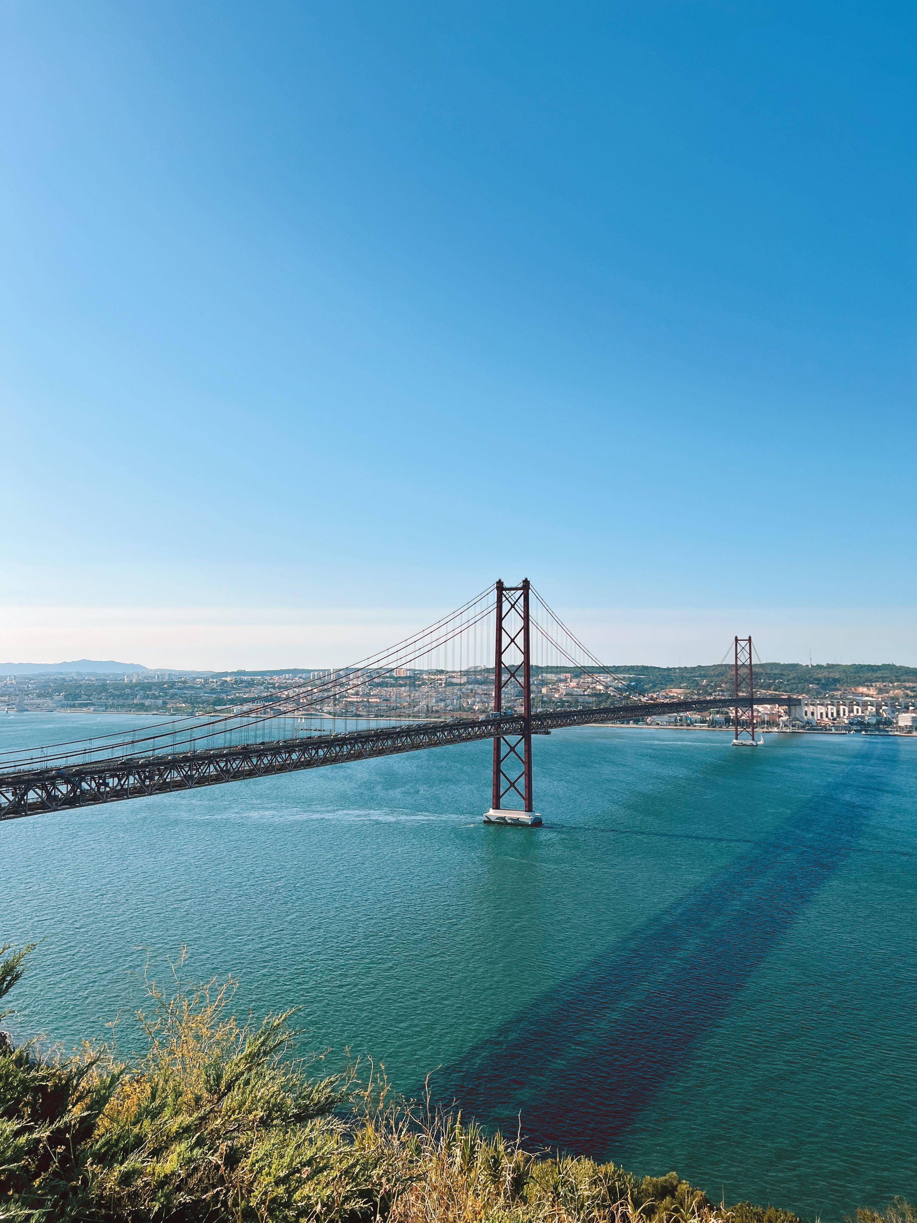 Iconic Bridge Span Over Blue Ocean Waters · Free Stock Photo