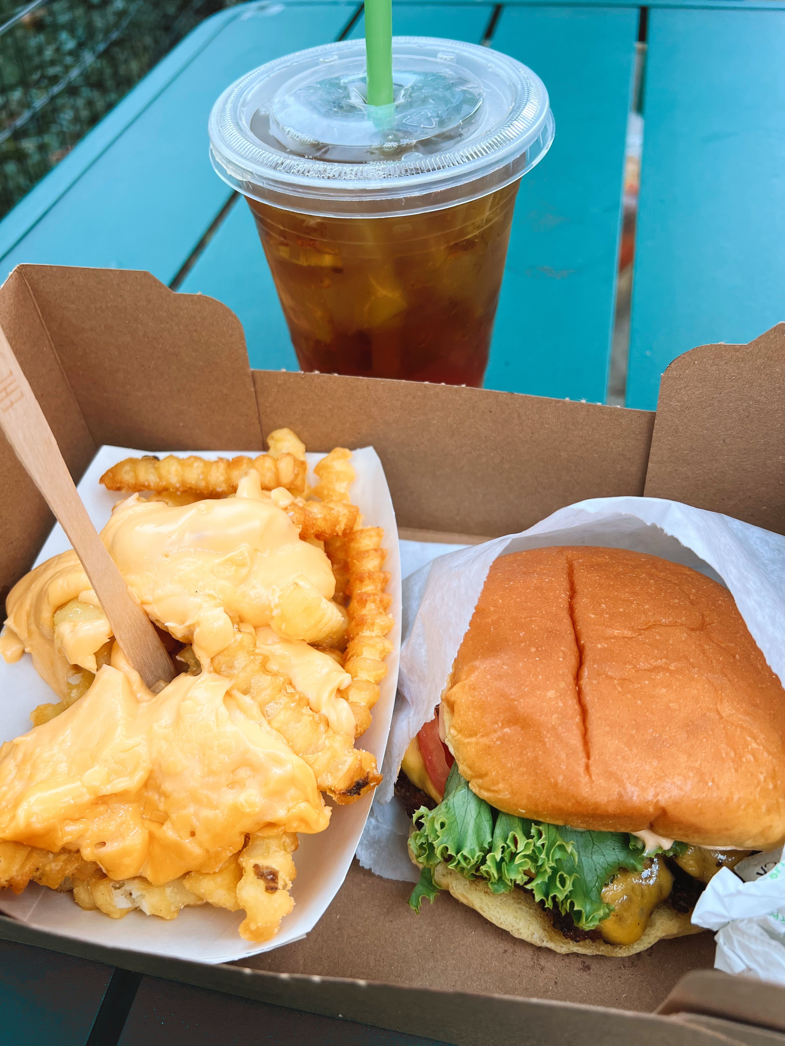 Delicious Cheeseburger and Fries with Iced Tea · Free Stock Photo
