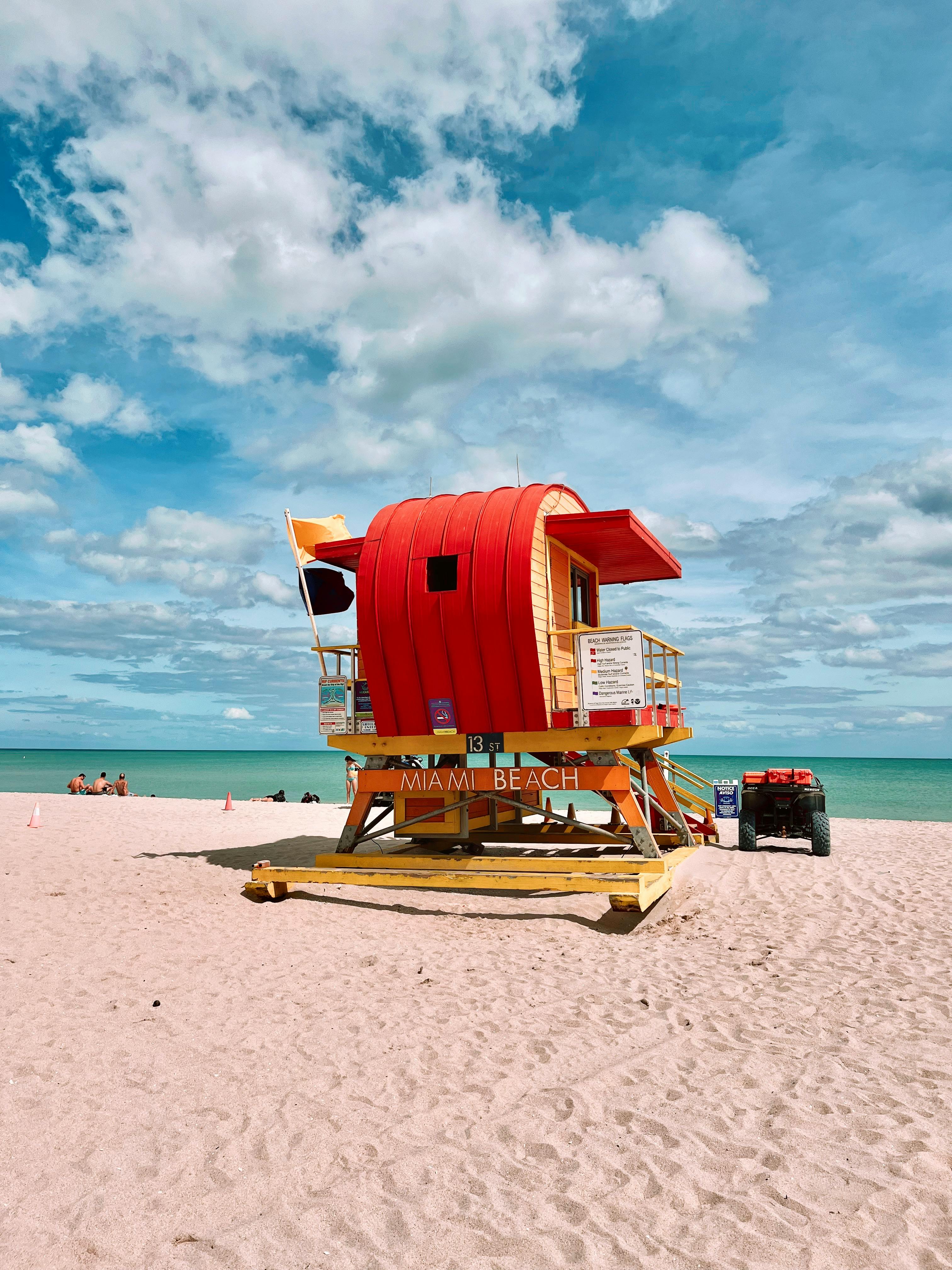 Lifeguard building on seashore against sundown sky · Free Stock Photo