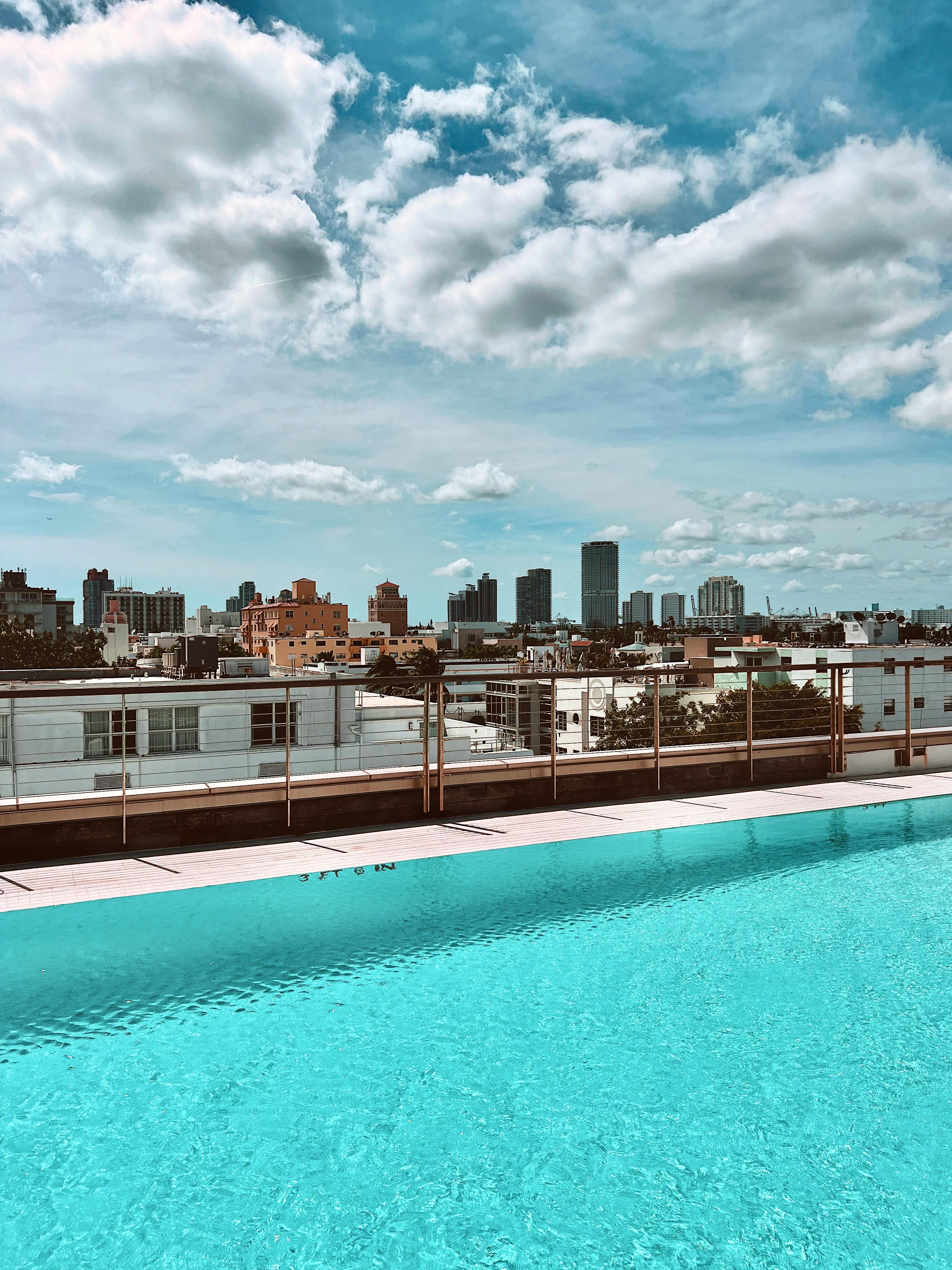 Rooftop Pool Overlooking Urban City Skyline · Free Stock Photo