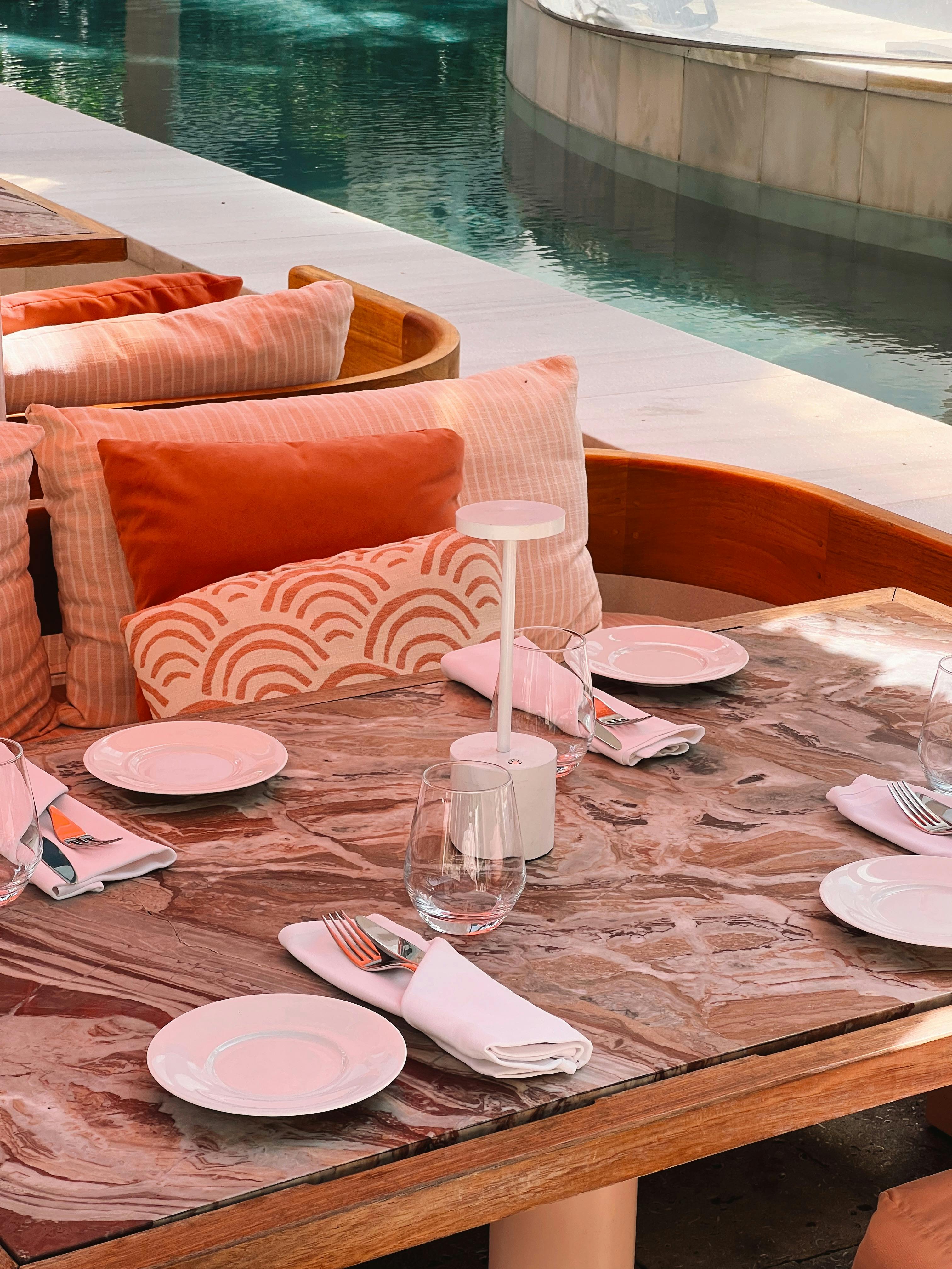 Elegant Outdoor Dining Setup by Poolside · Free Stock Photo