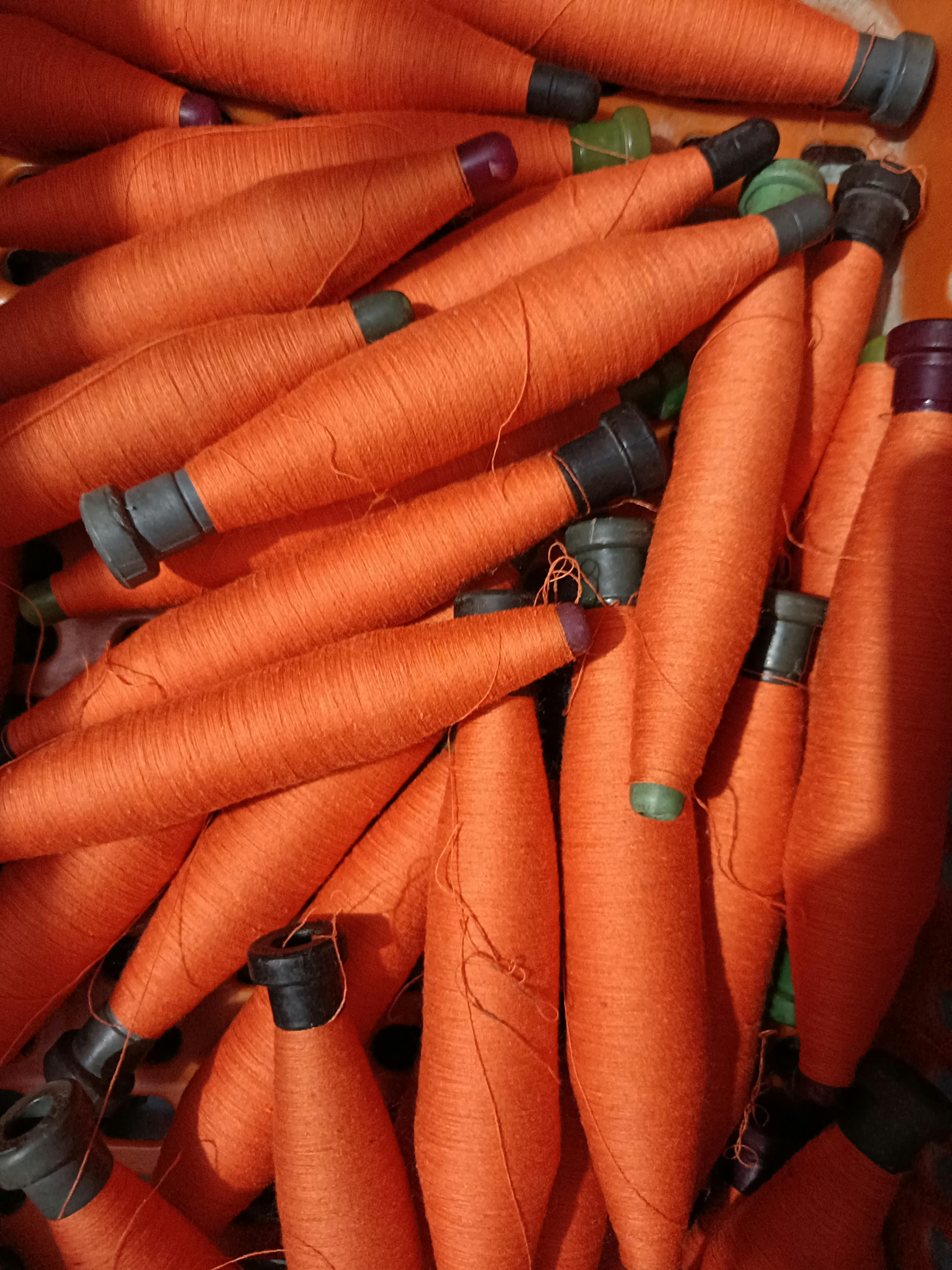 Vibrant Orange Thread Spools for Sewing Projects · Free Stock Photo
