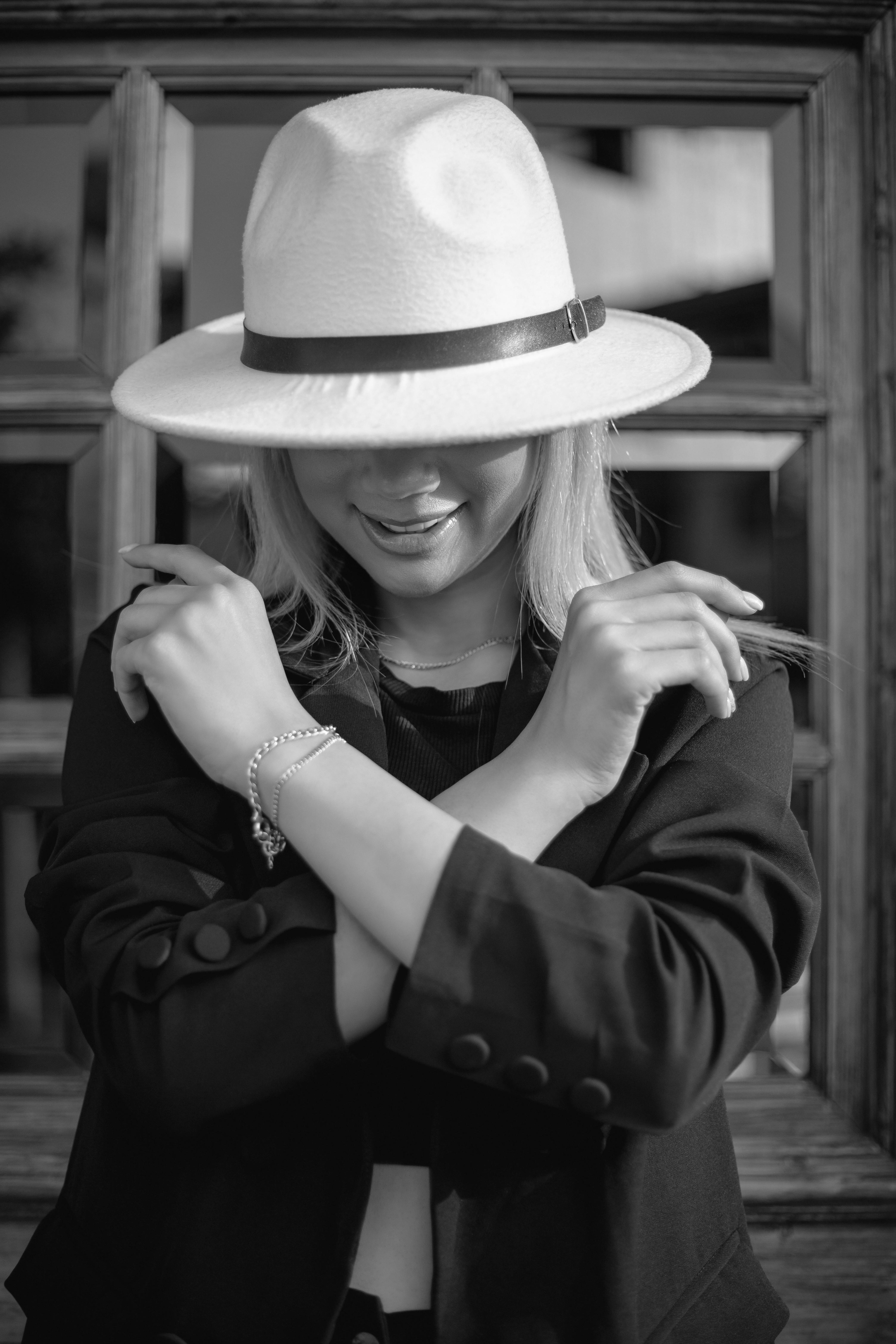 Elegant Woman in Fedora Hat with Stylish Pose · Free Stock Photo