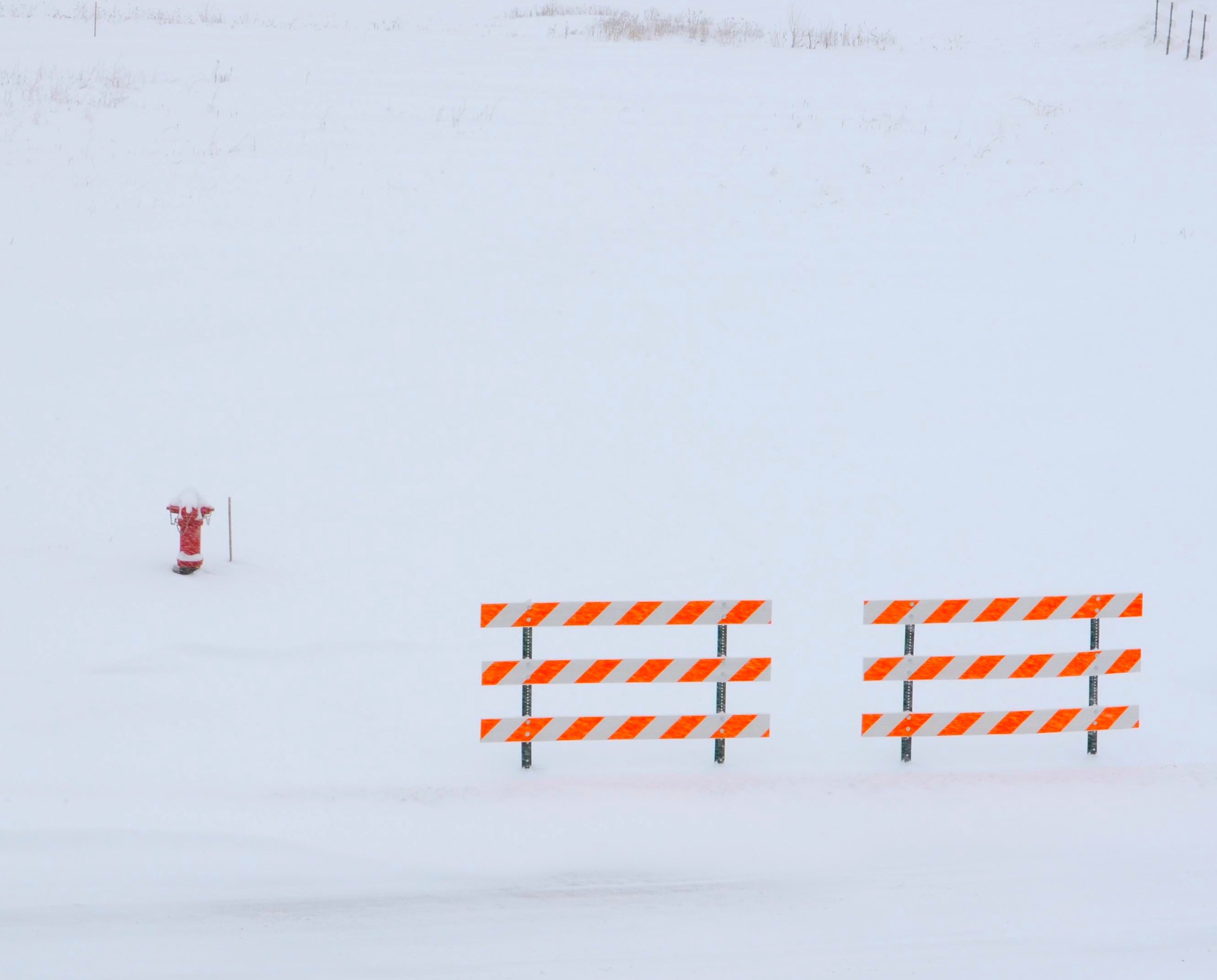 Winter Road Barricades and Fire Hydrant in Snow · Free Stock Photo