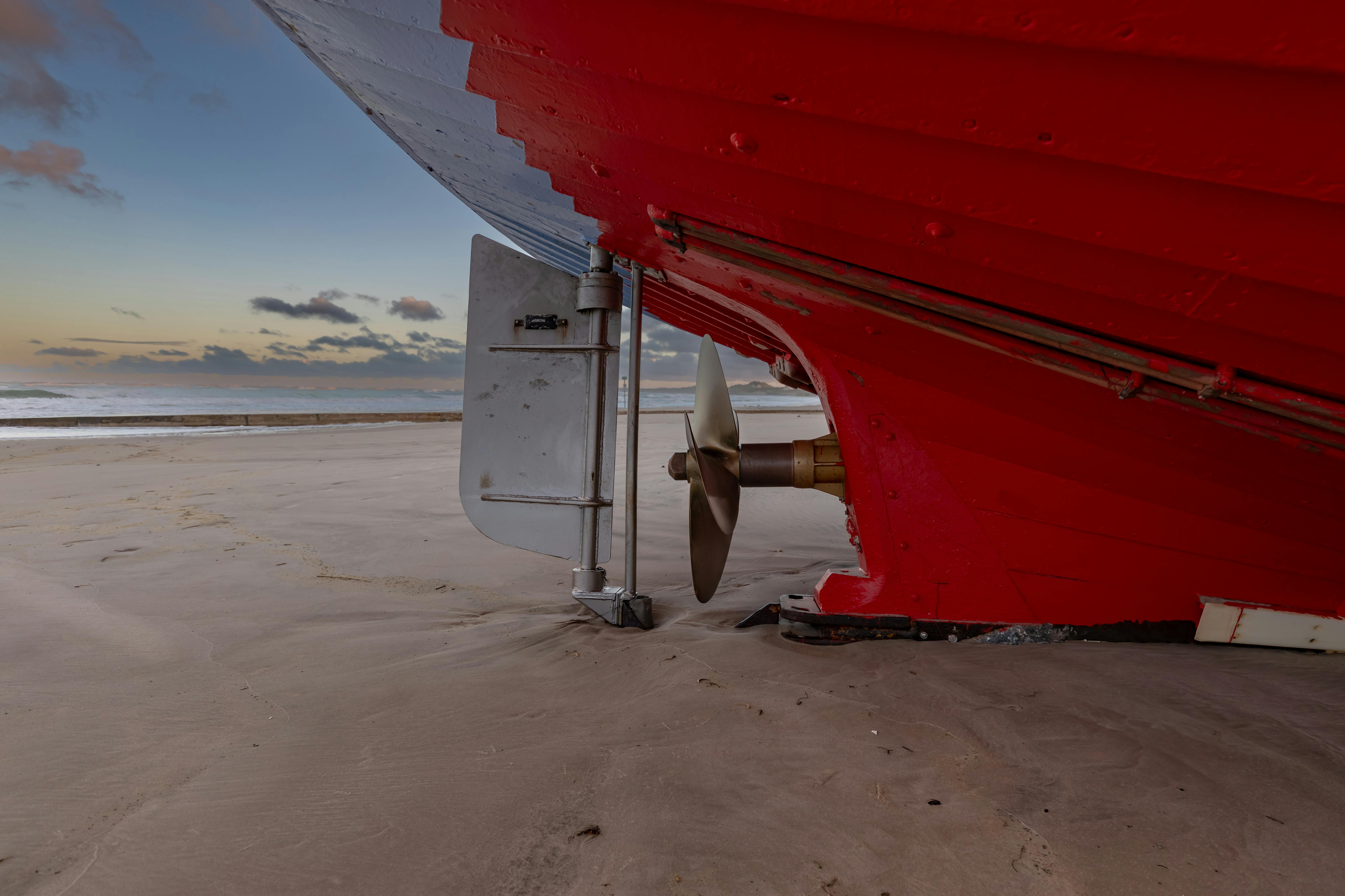 Red Boat Beached at Løkken, Denmark Sunset · Free Stock Photo