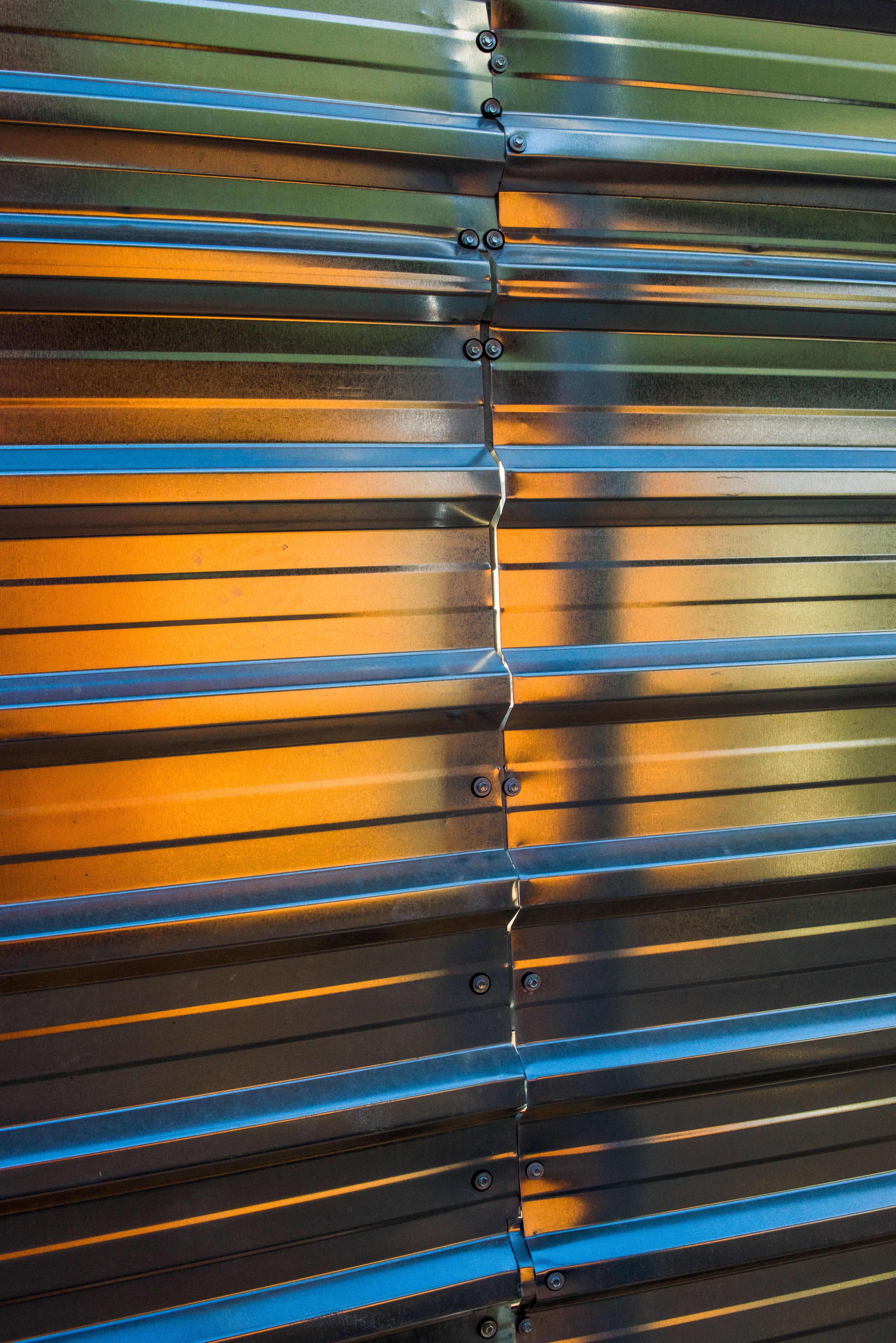 Colorful Reflections on Metal Surface · Free Stock Photo