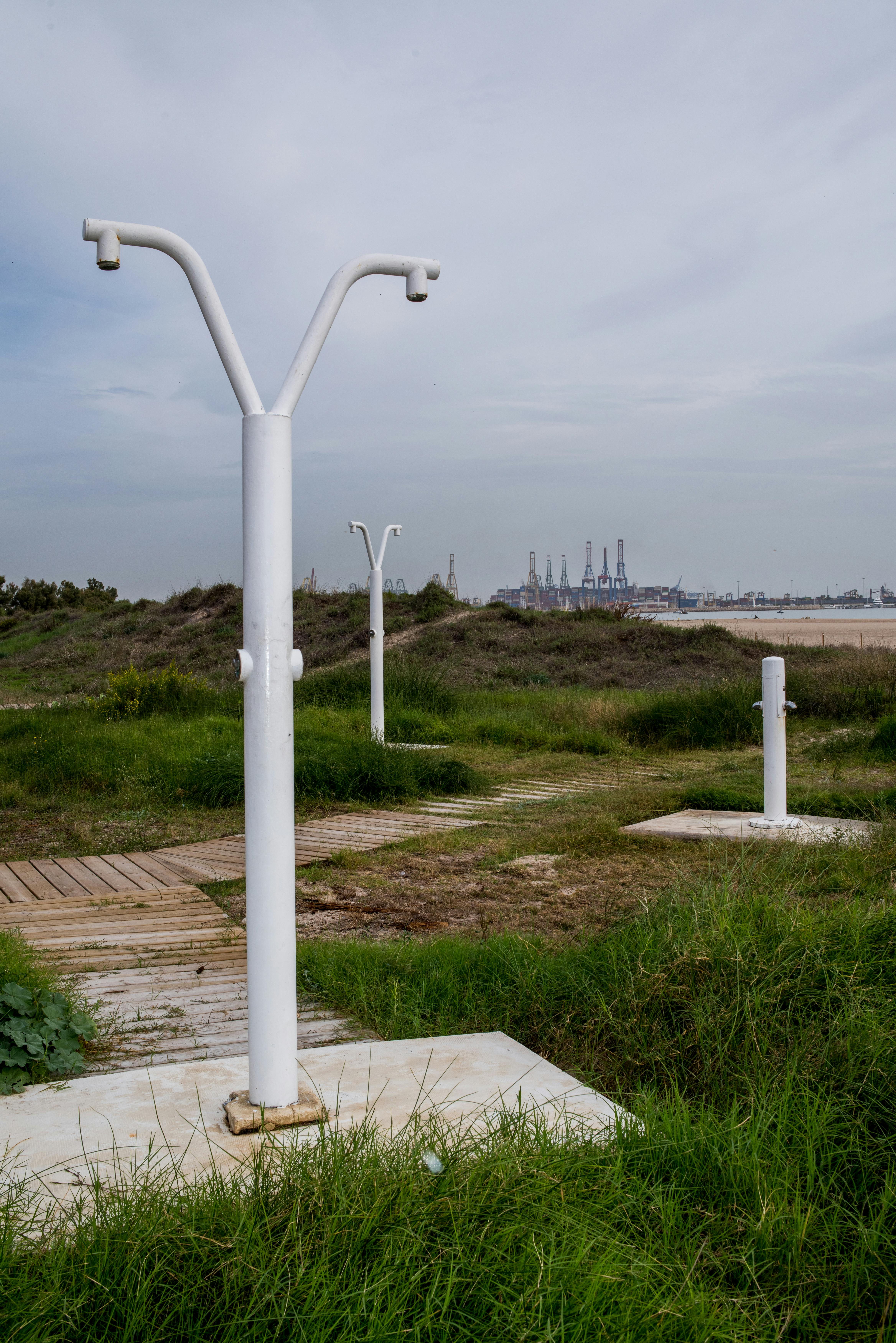 Outdoor Beach Showers in Coastal Landscape Setting · Free Stock Photo