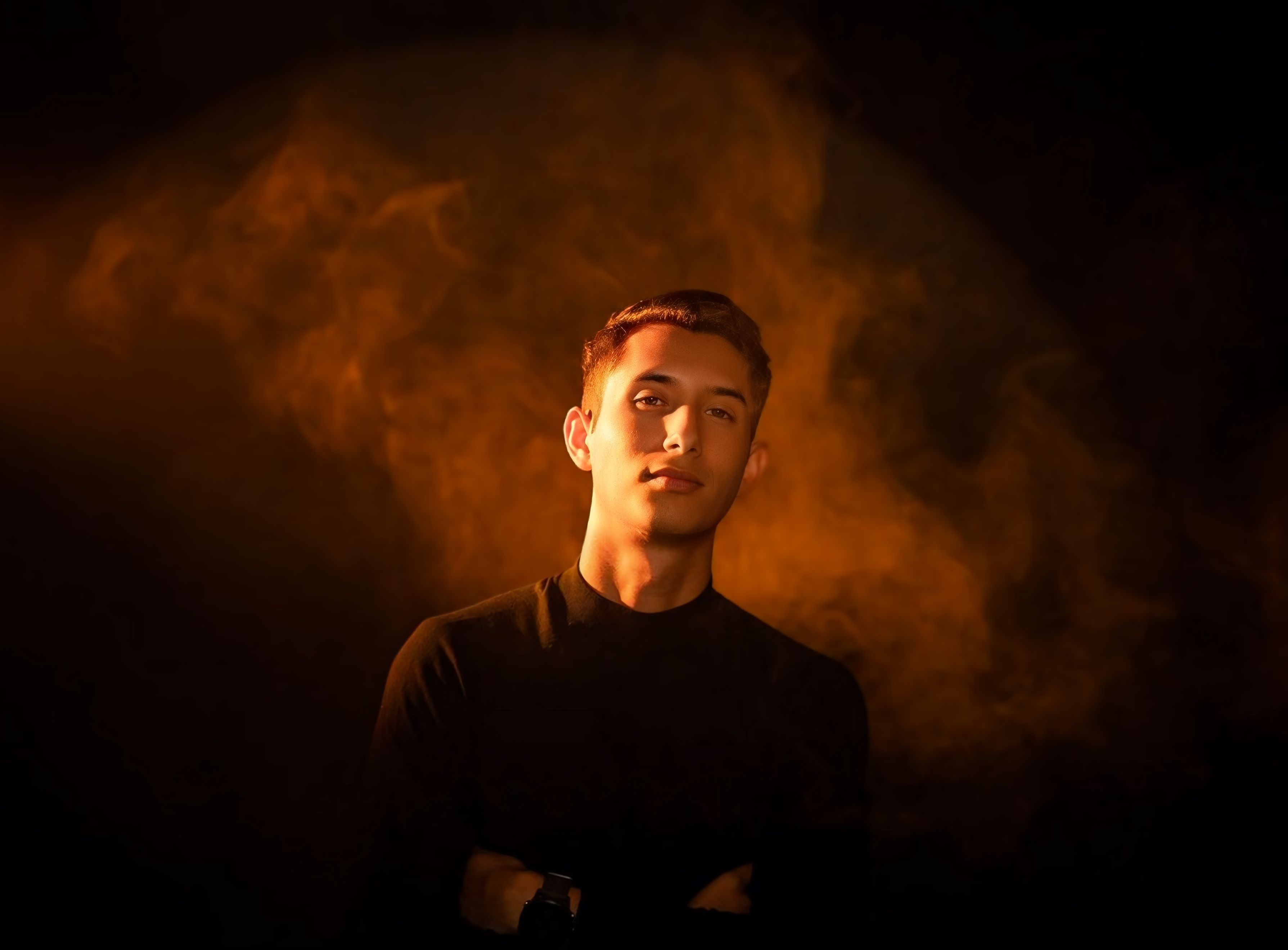 Moody Portrait of Young Man in Orange Light · Free Stock Photo
