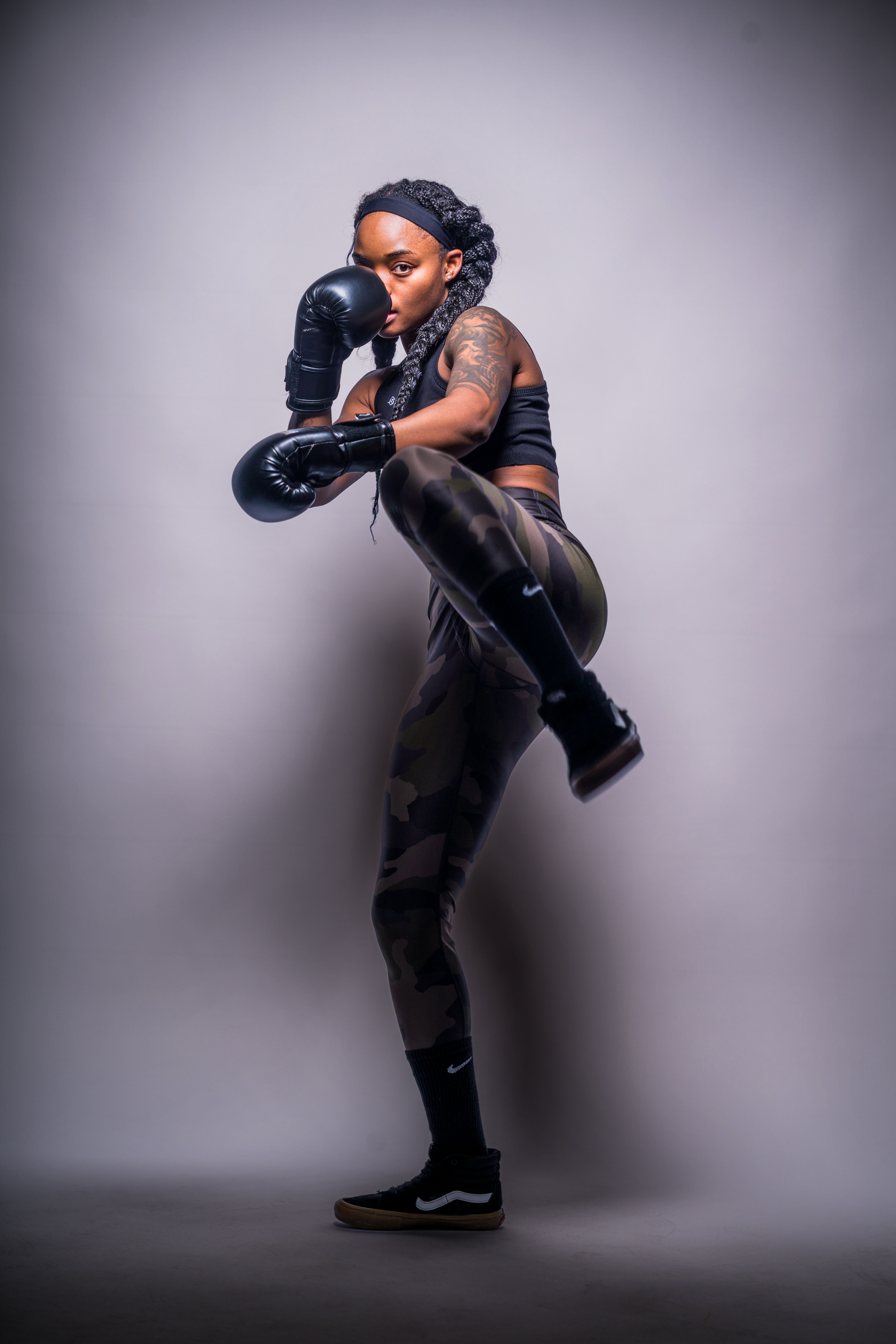 Confident Female Boxer in Athletic Pose · Free Stock Photo