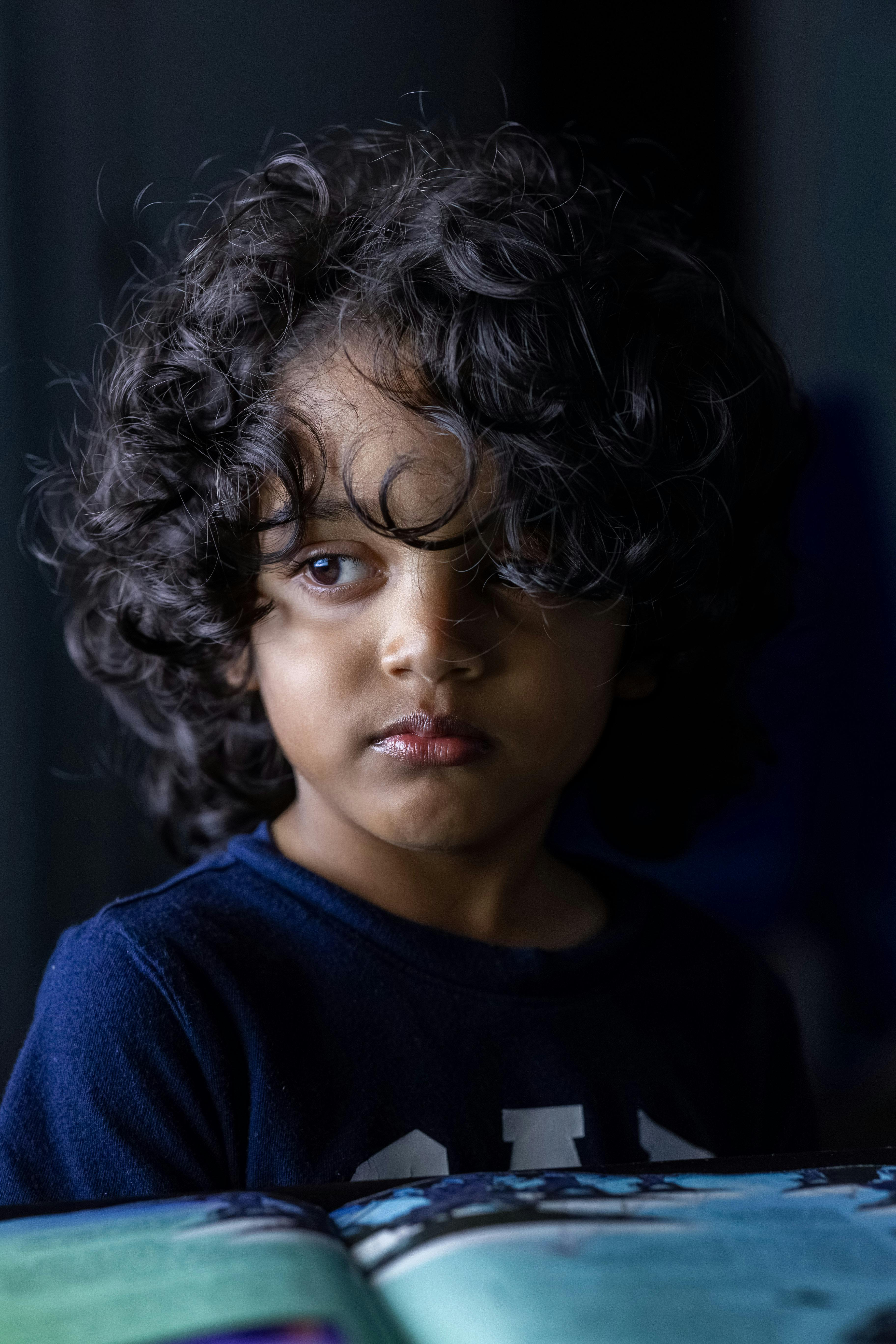 Thoughtful Child Portrait in Natural Light · Free Stock Photo
