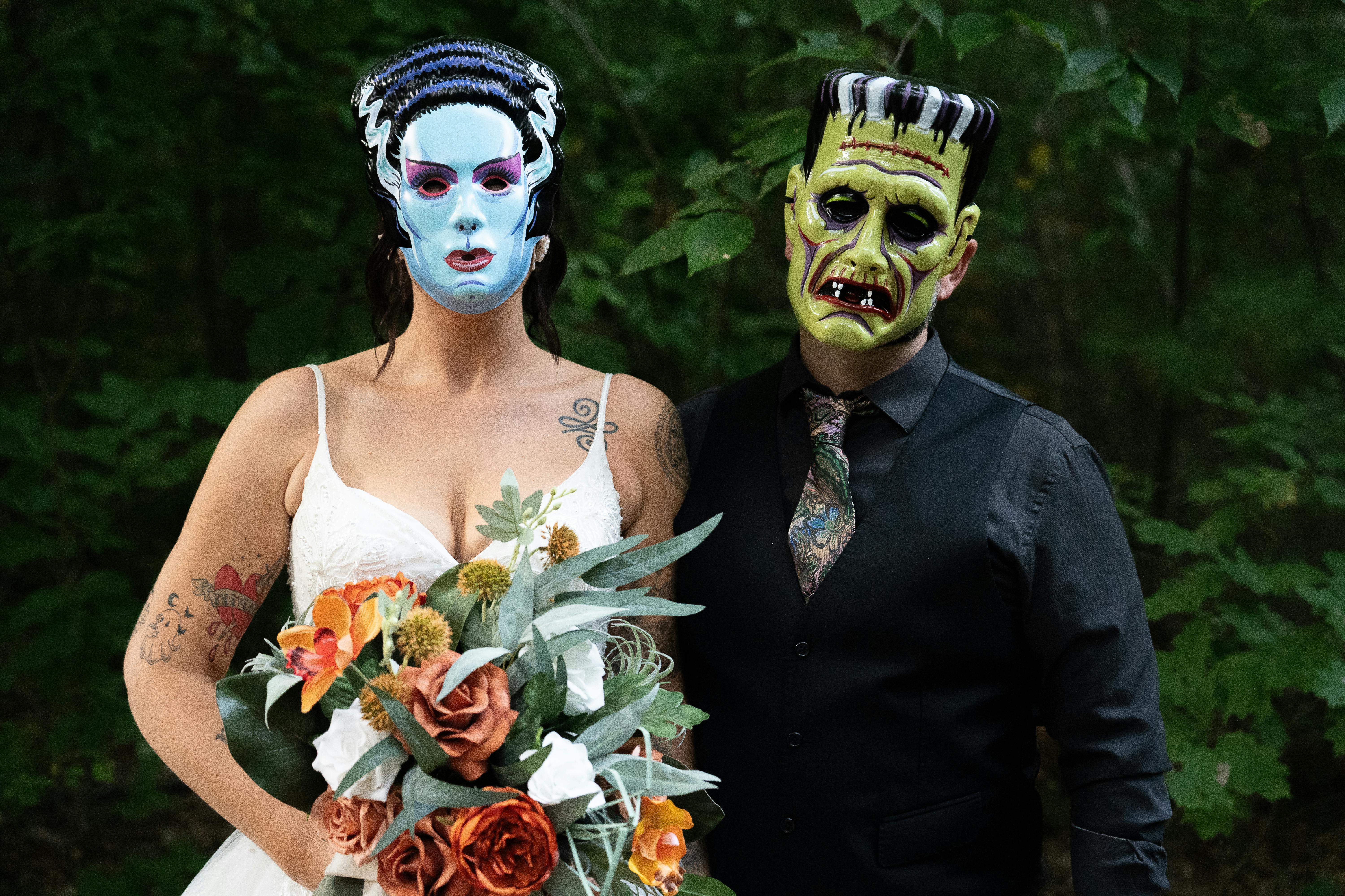 Masked Wedding Couple in Forest Setting · Free Stock Photo