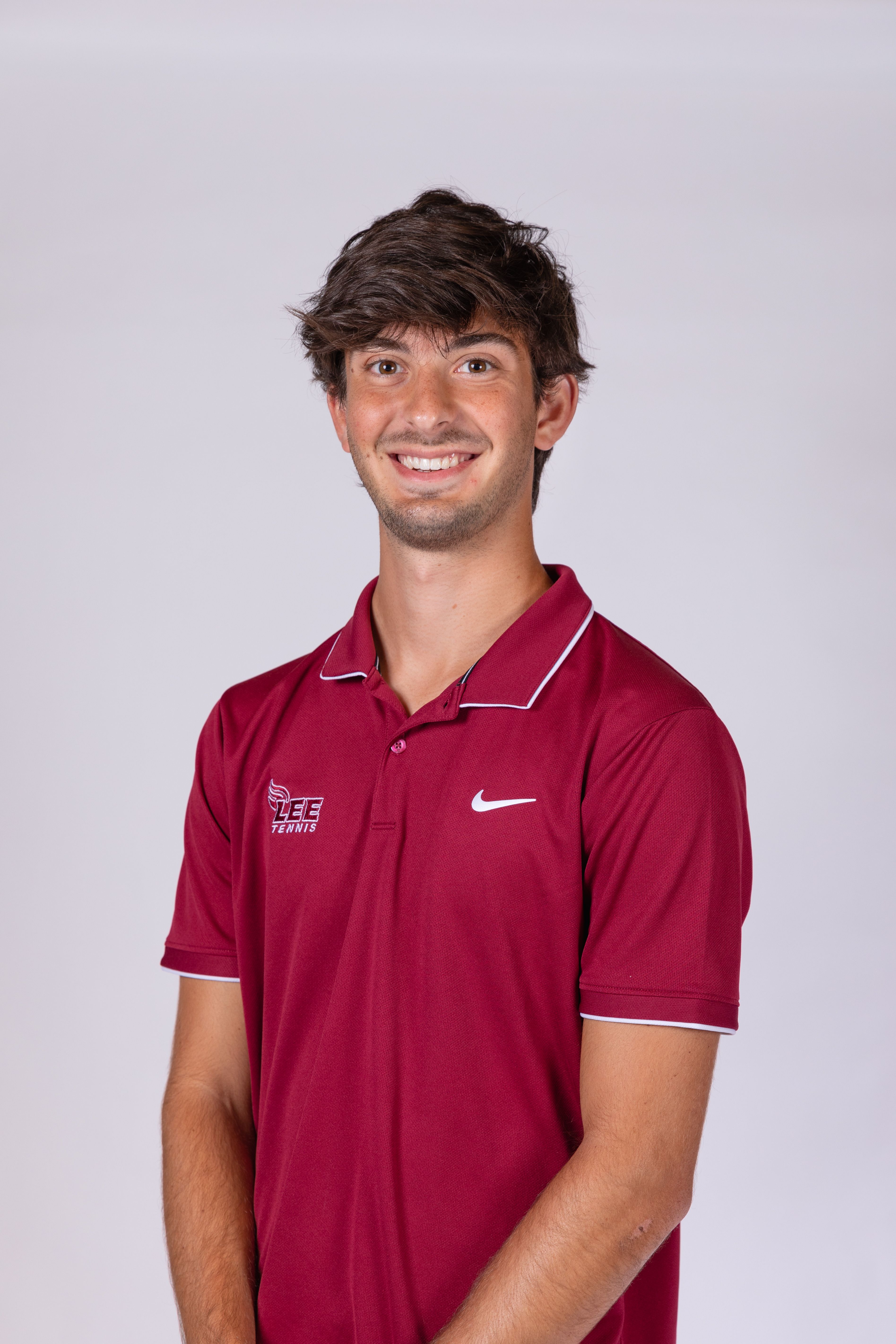 Smiling Young Man in Red Polo Shirt Portrait · Free Stock Photo