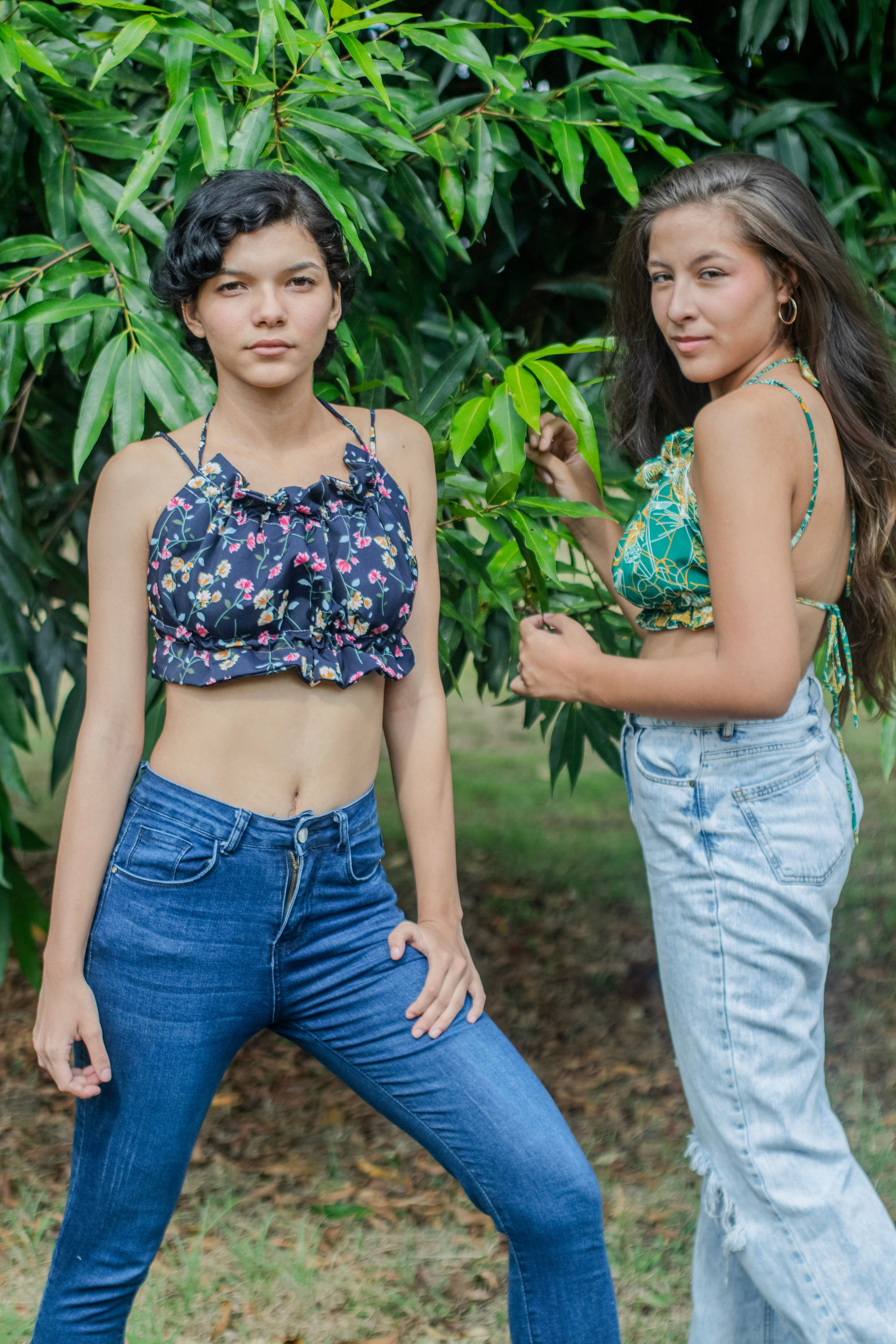 Young Women Posing Naturally in Greenery Outdoors · Free Stock Photo