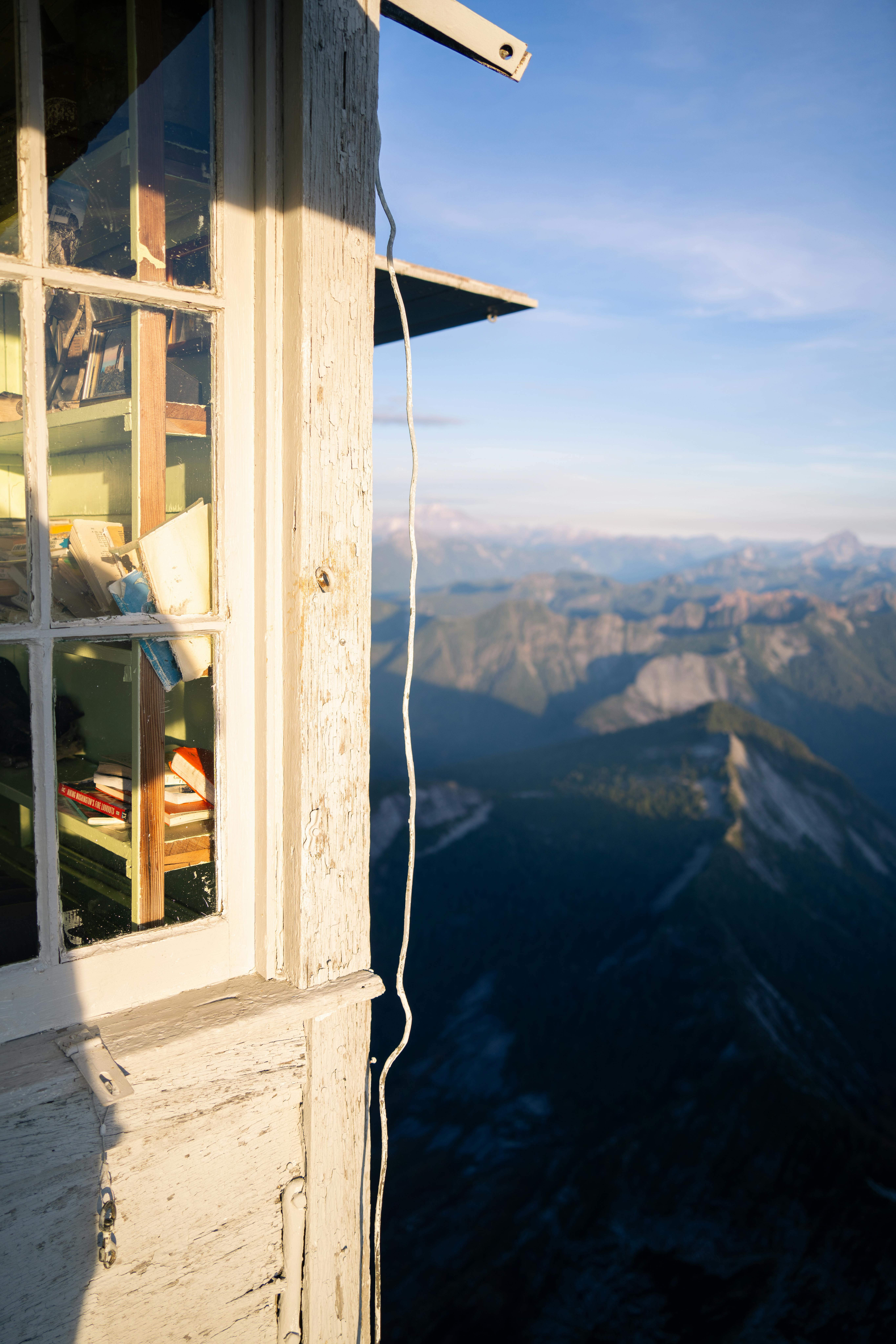 Scenic Mountain View from a Rustic Cabin Window · Free Stock Photo