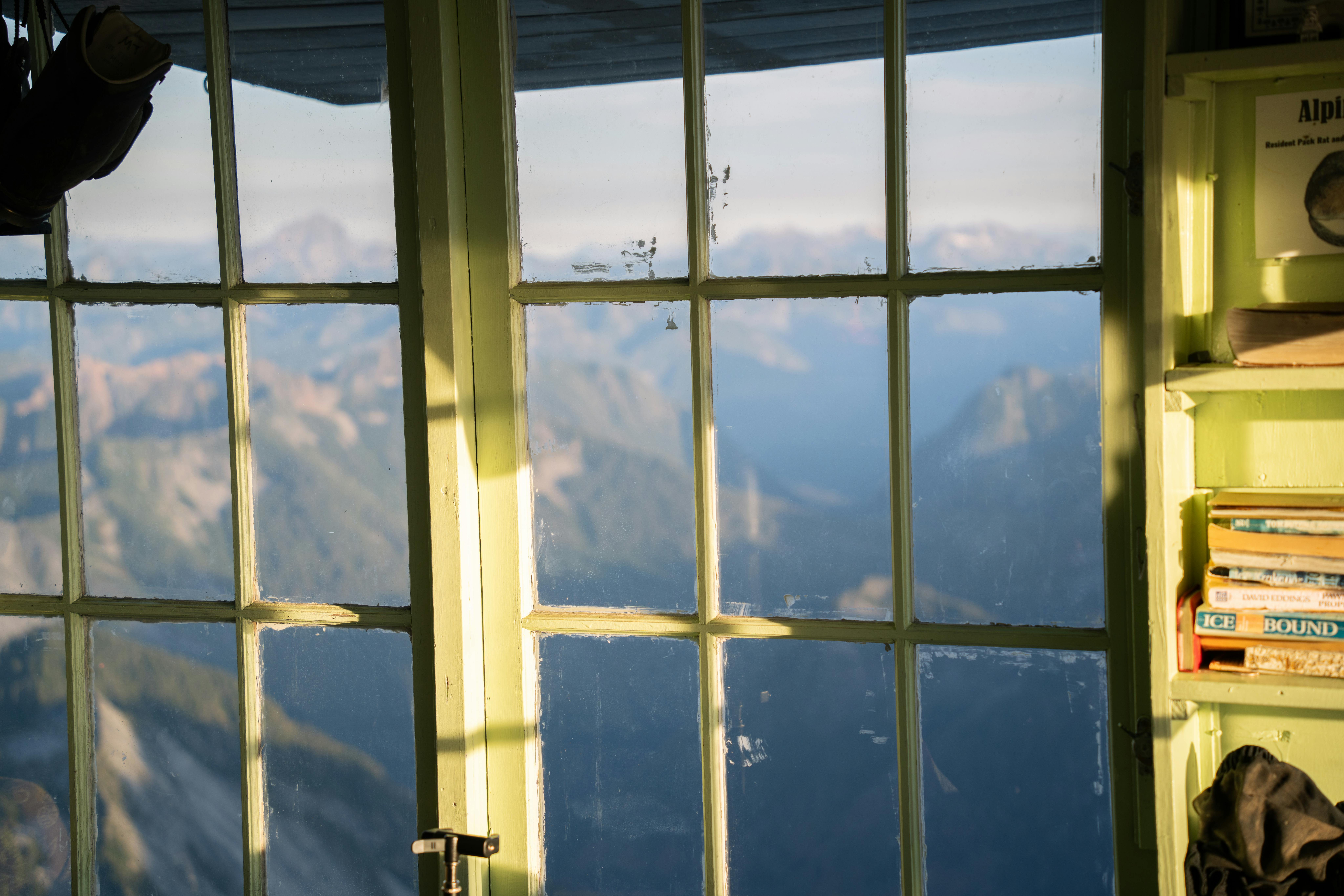 Serene Mountain View from Rustic Cabin Window · Free Stock Photo