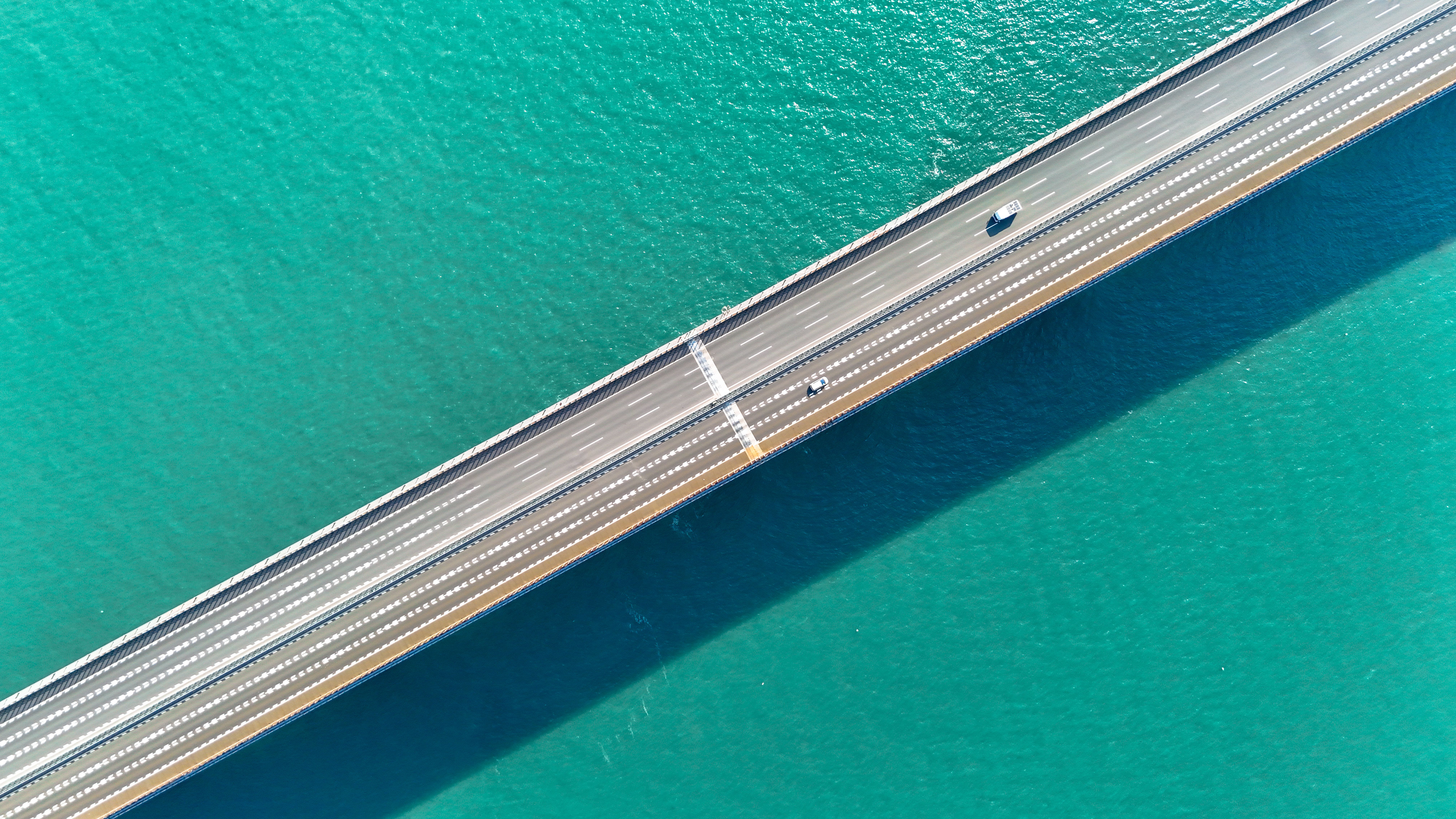 Aerial View of a Bridge Over Turquoise Water · Free Stock Photo