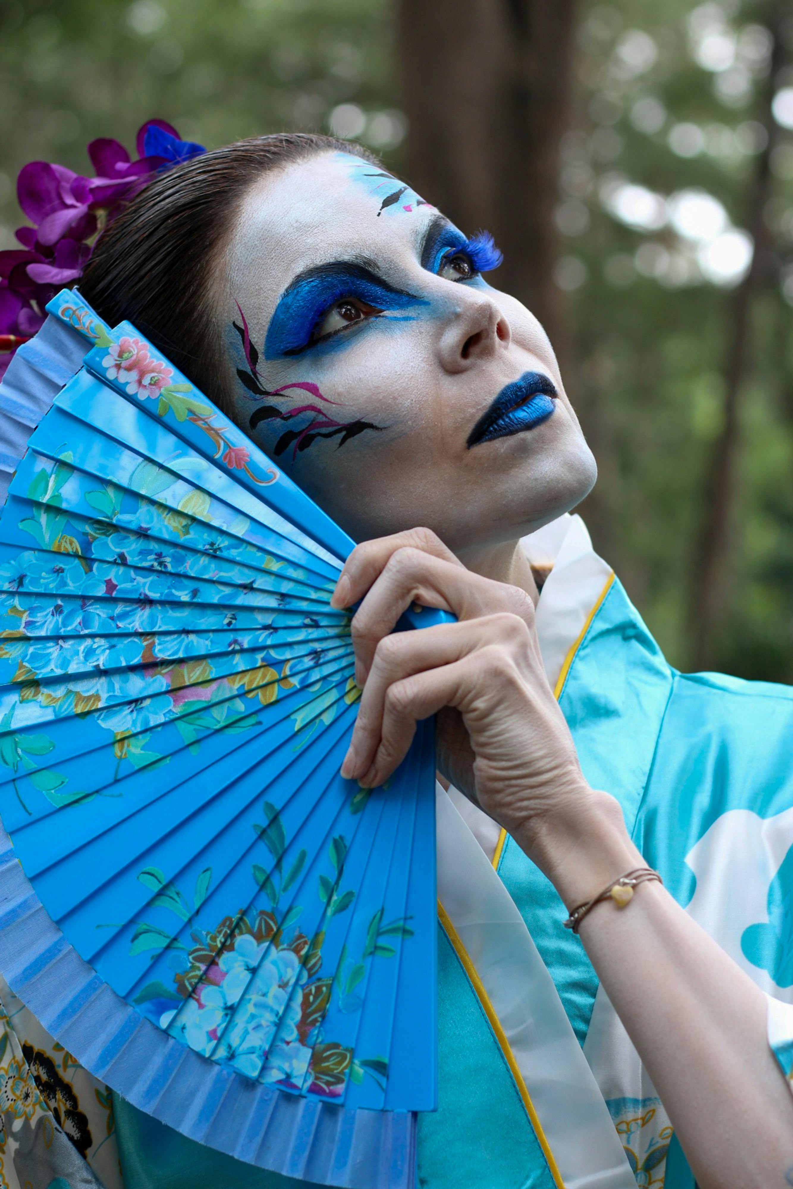 Dramatic Geisha-Inspired Portrait with Fan · Free Stock Photo