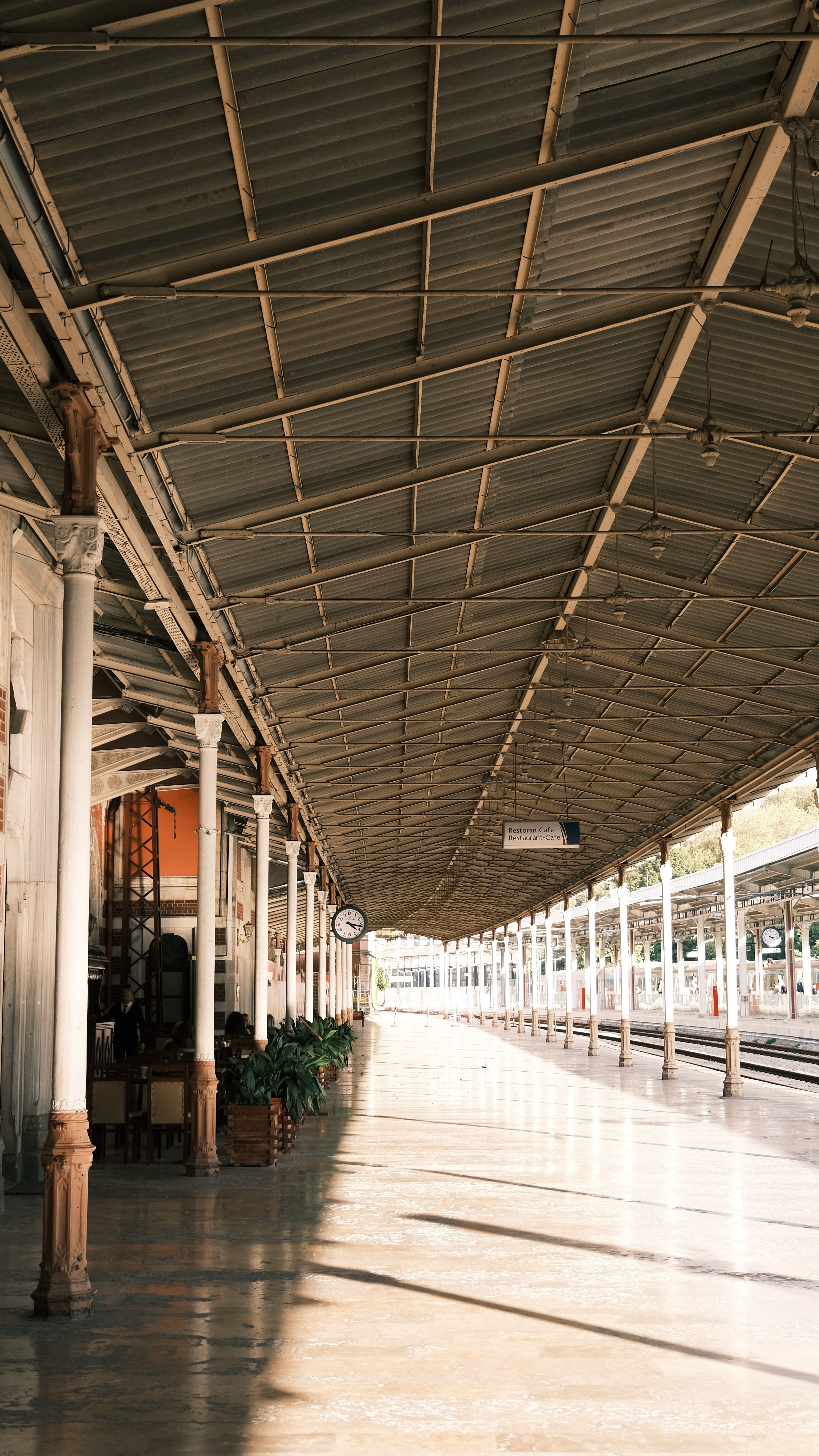 Empty Railway Station Platform with Classic Architecture · Free Stock Photo