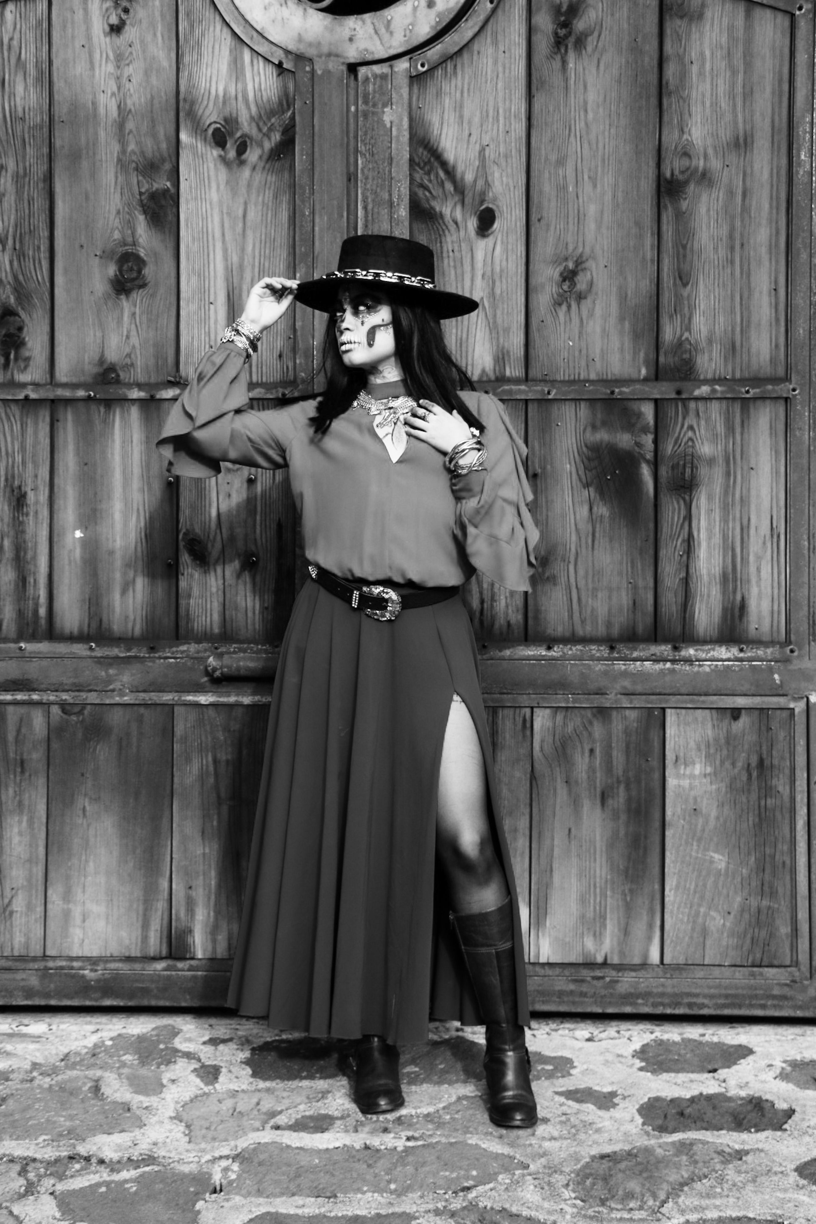 Woman in Western Attire Holding Smoking Gun · Free Stock Photo