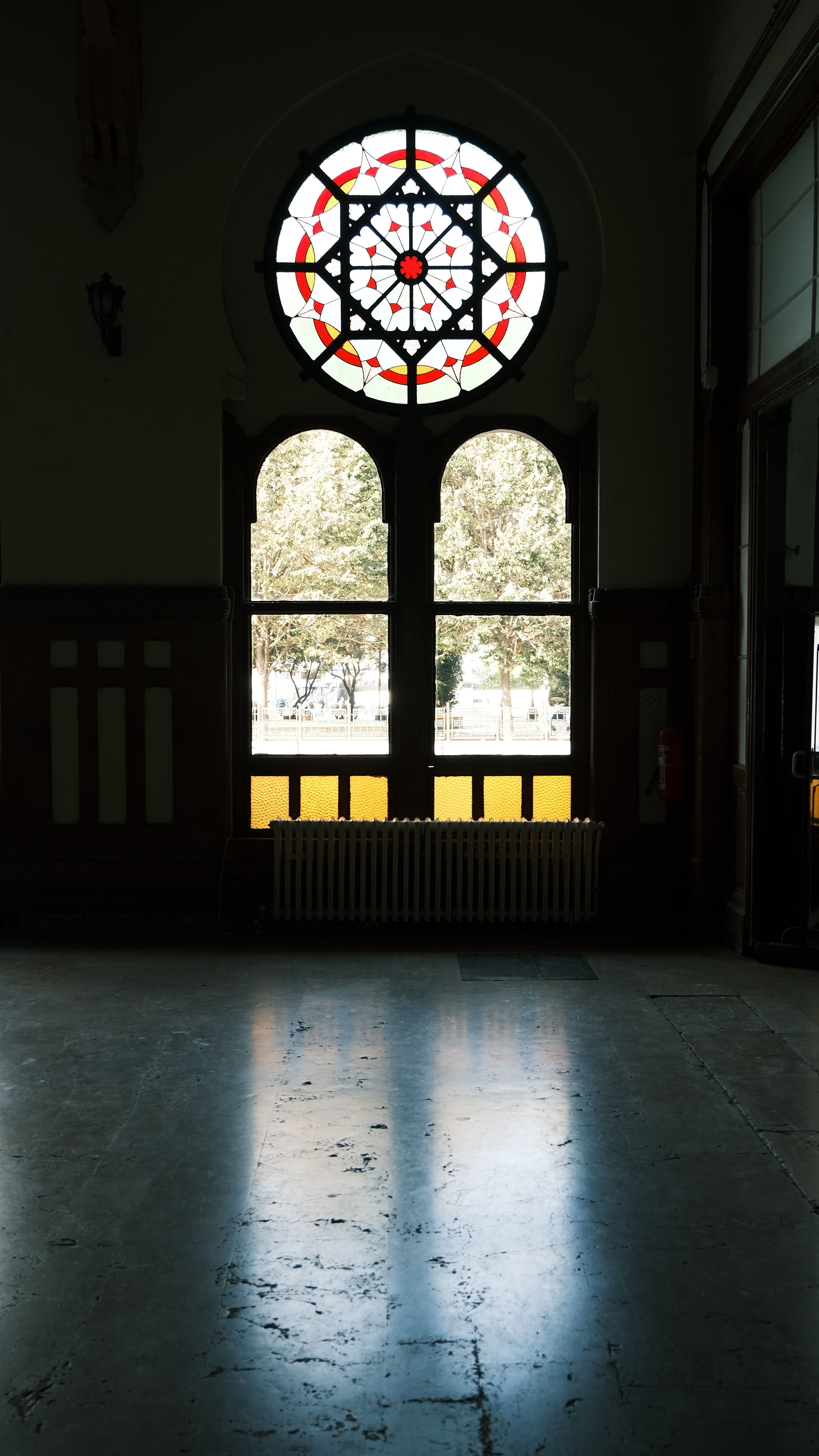 Historic Building Interior with Stained Glass Window · Free Stock Photo