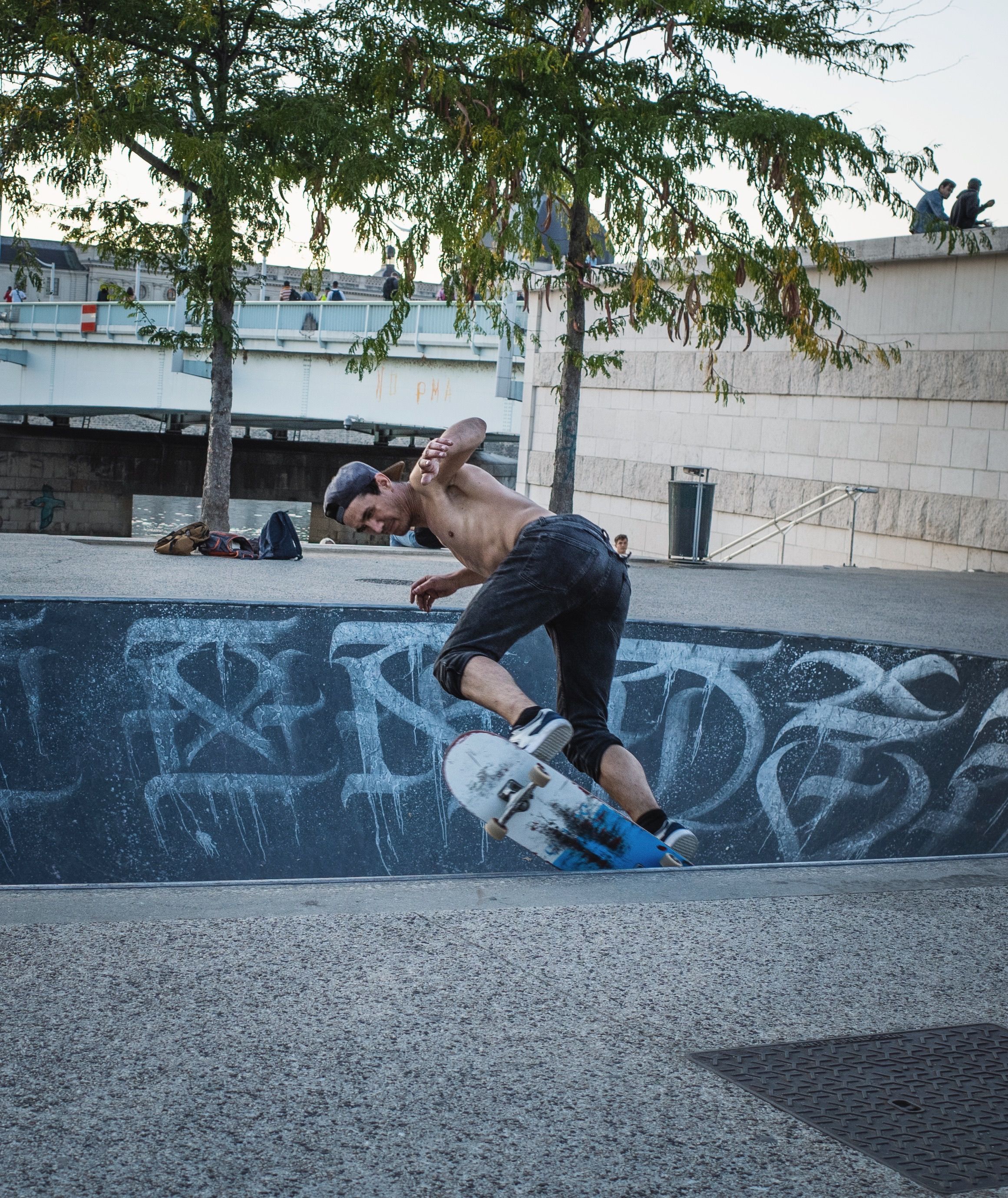 Skilled Asian skater performing tricks on skateboard · Free Stock Photo