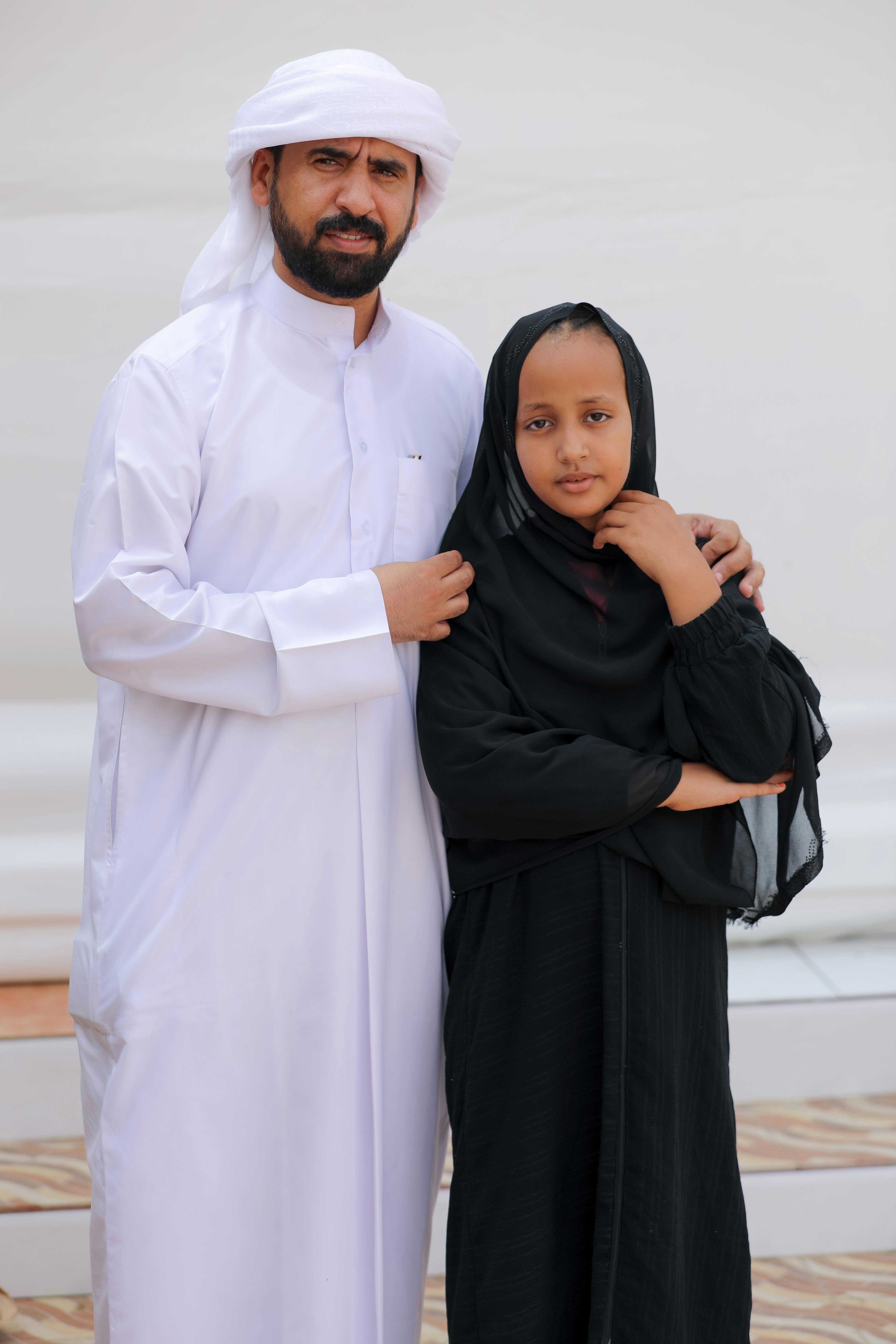 Portrait of Middle Eastern man and girl in traditional attire · Free ...