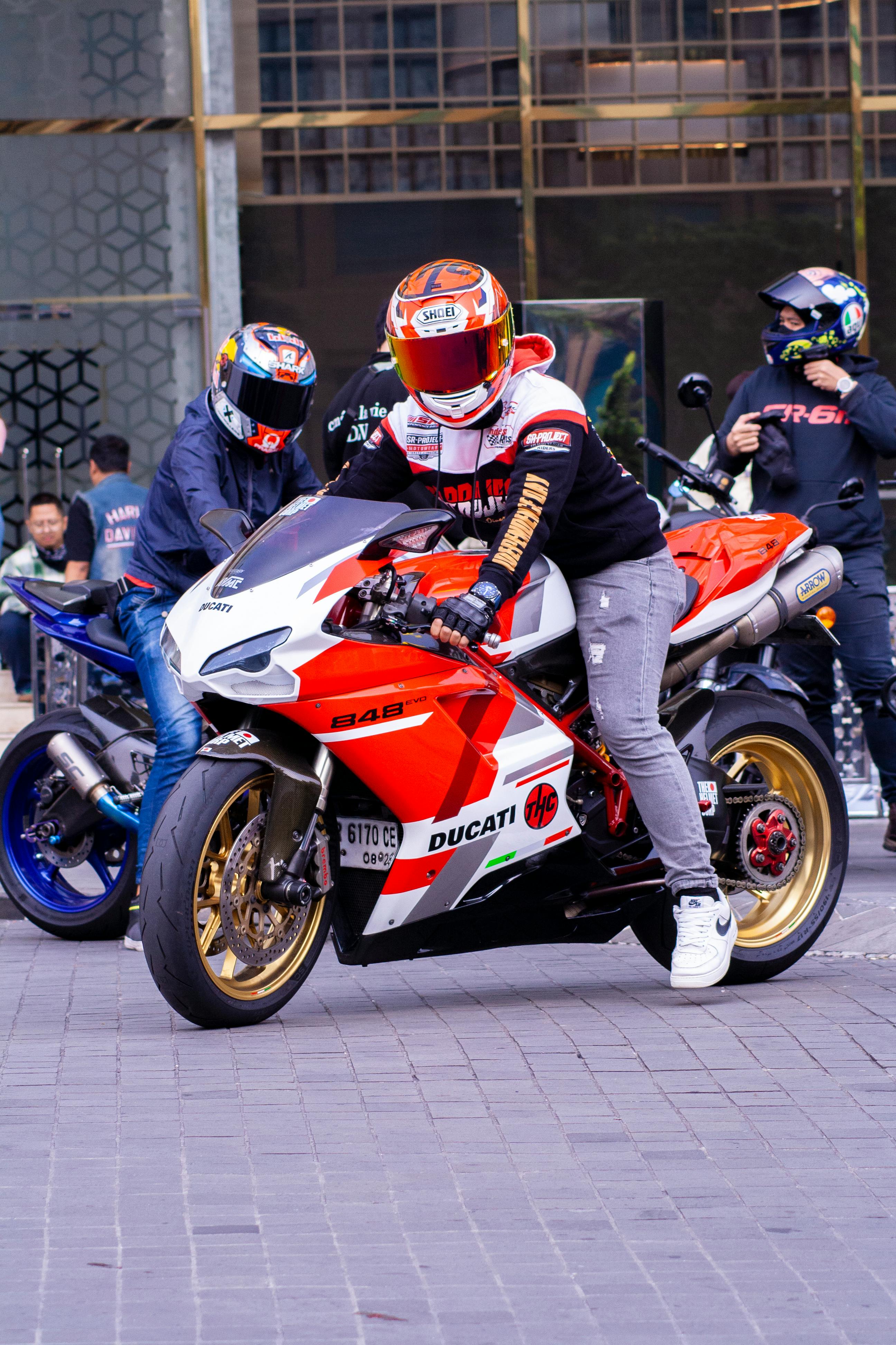 Ducati Motorcycle Enthusiasts Gather Outdoors · Free Stock Photo