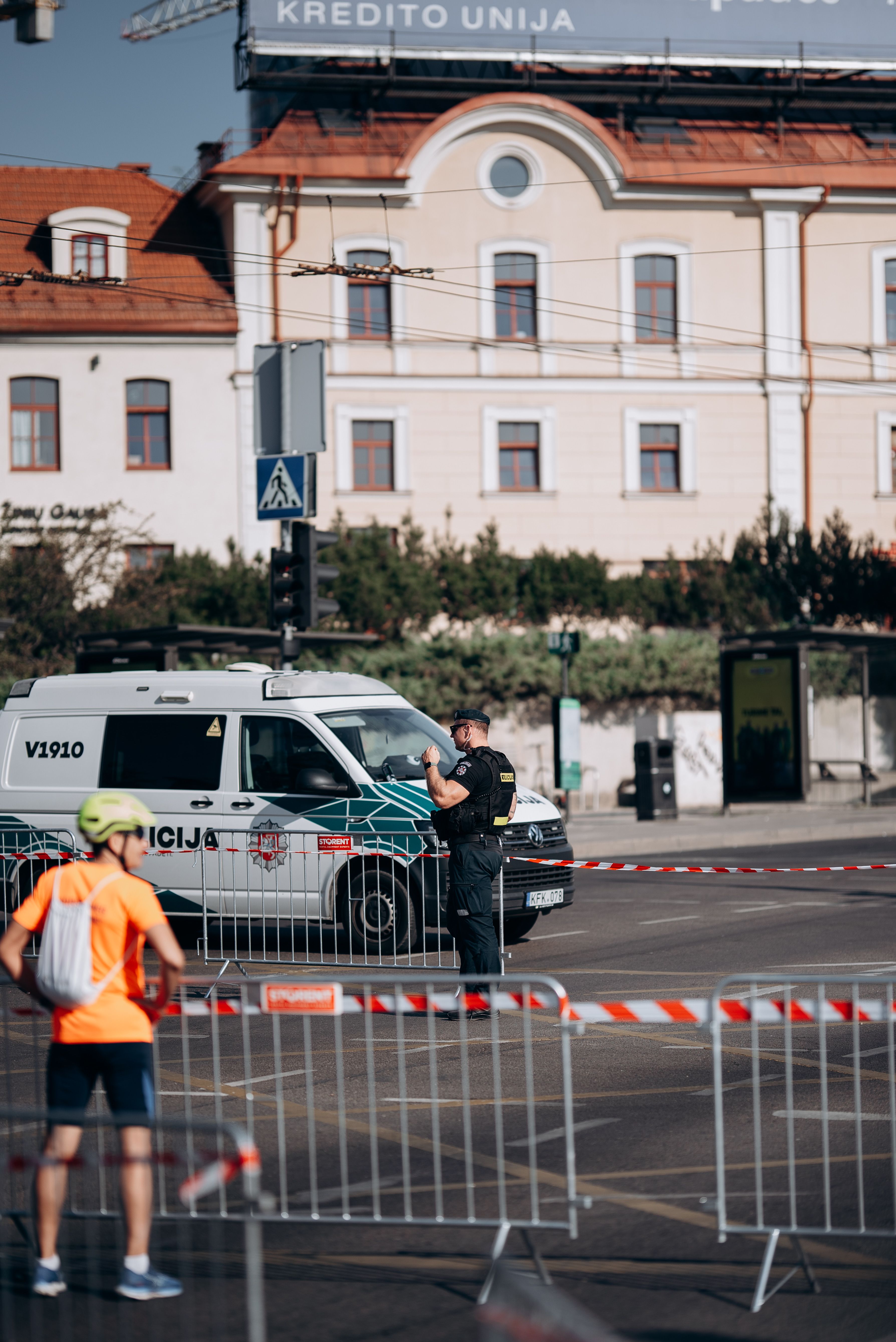 Police Officer Managing City Street Traffic Scene · Free Stock Photo
